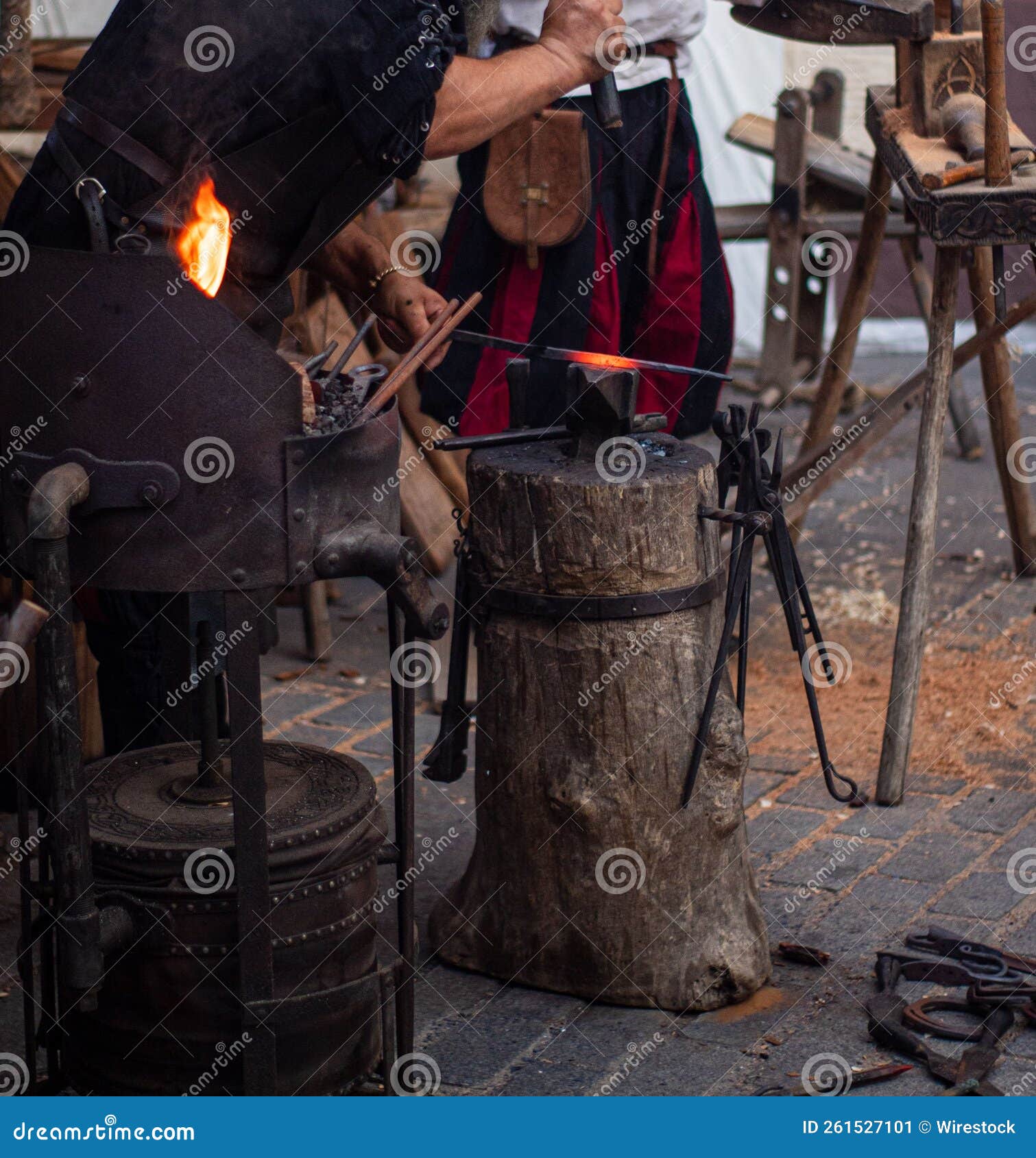 Partial View of a Blacksmith Shaping the Hot Metal in His Smithy Stock ...