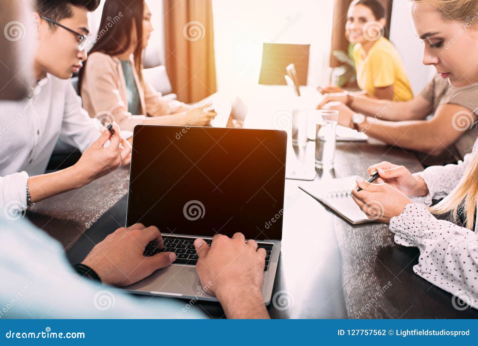 Partial View of Businessman Typing on Laptop with Blank Screen while ...
