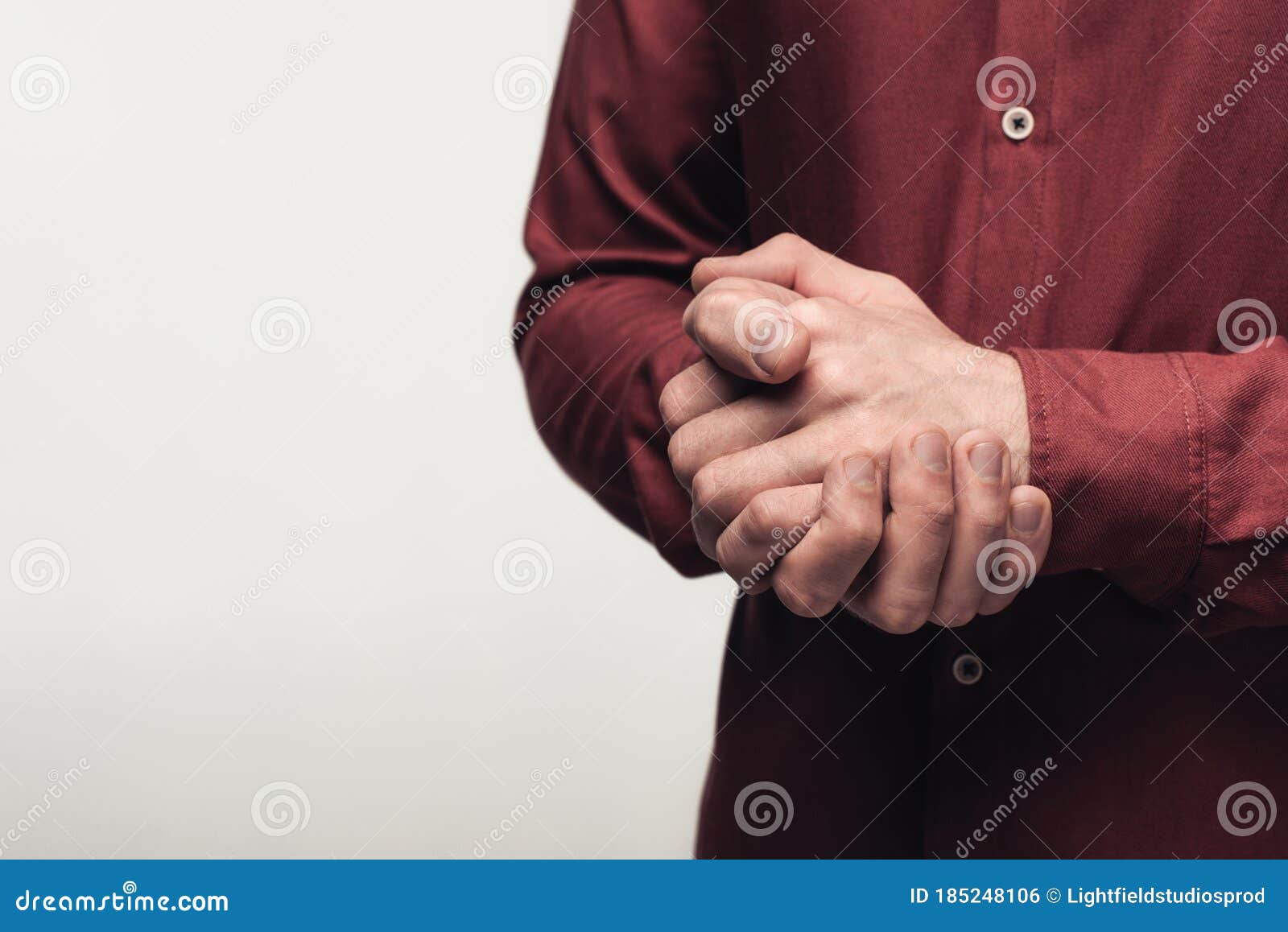 View of Man with Clenched Hands Using Body Language Isolated on Grey ...
