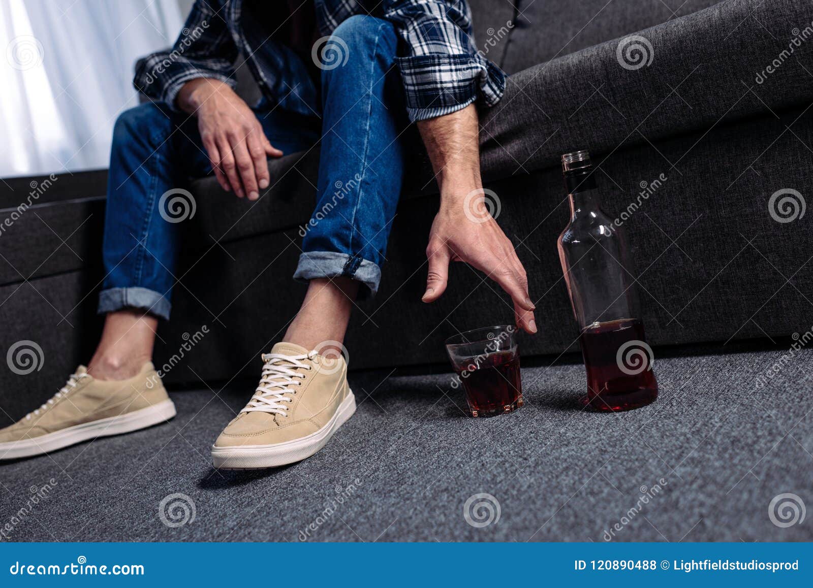 Partial View of Man Taking Alcohol Drink while Sitting on Sofa Stock ...