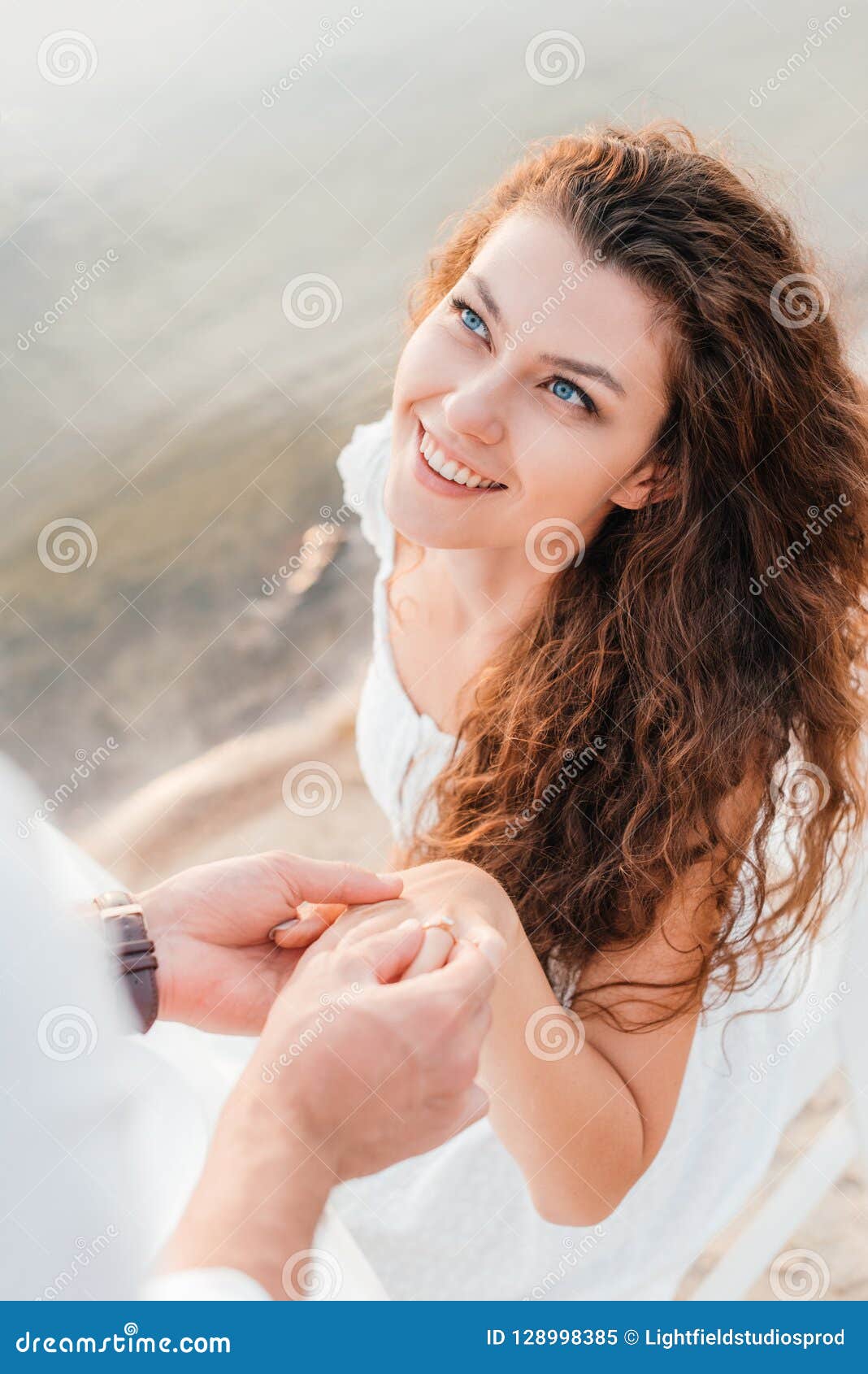Partial View of Man Wearing Proposal Ring on Womans Finger Stock Image ...