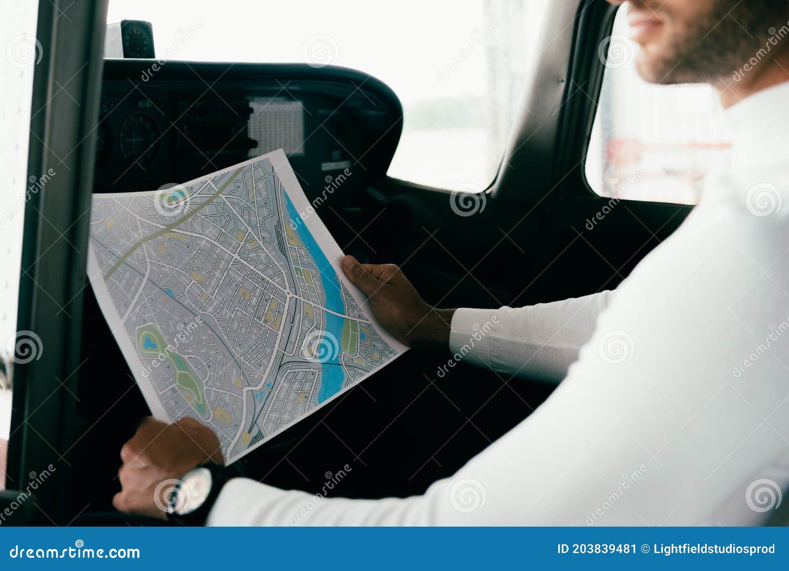 Partial View of Pilot Holding Map Stock Image - Image of adult, cropped ...
