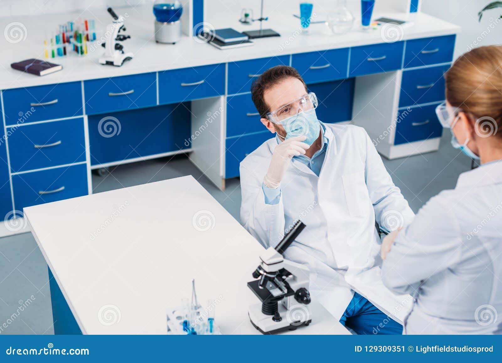 Partial View of Scientists Having Discussion at Workplace Stock Image ...