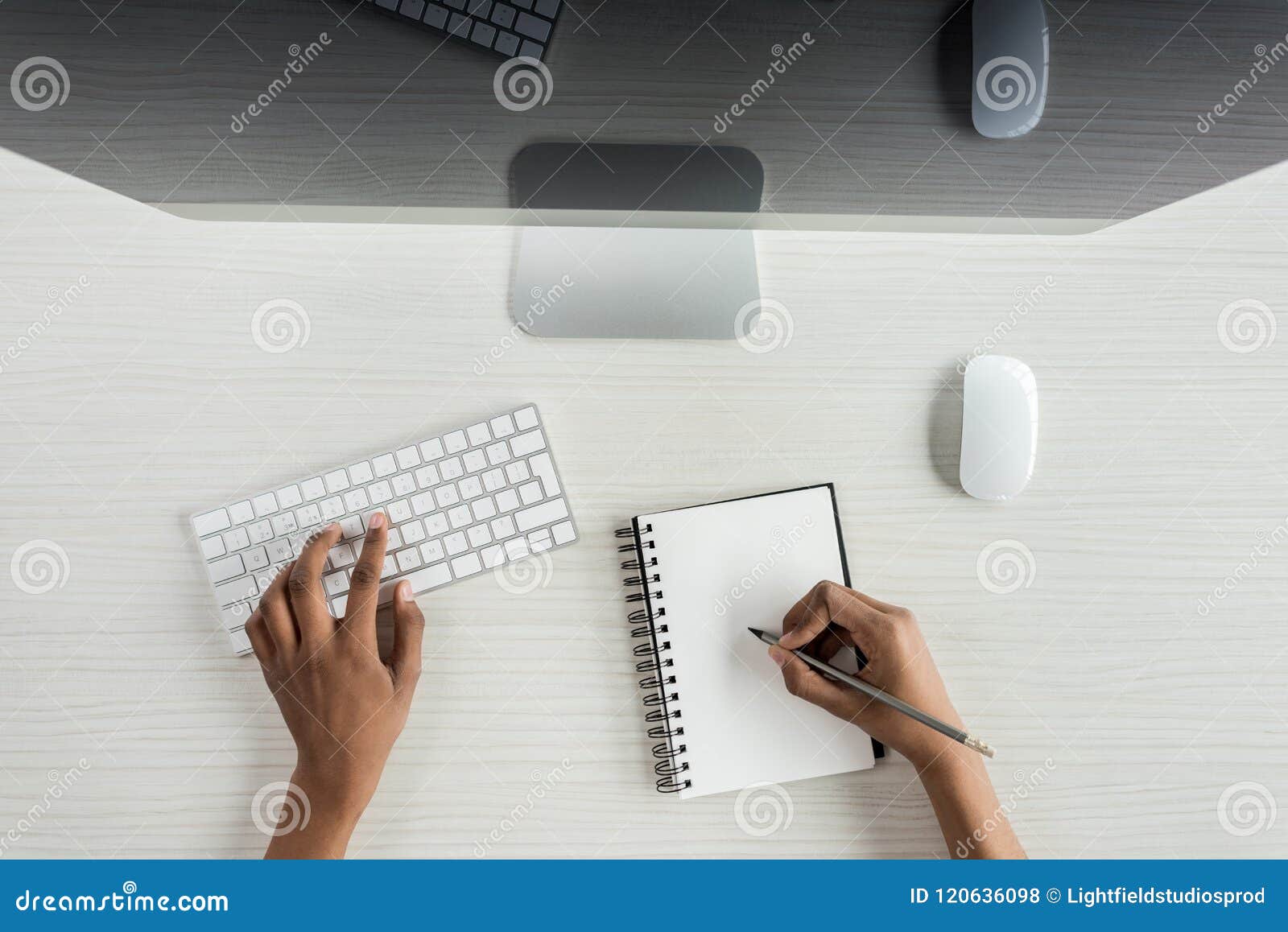 Partial View of Student Writing in Notebook and Using Digital Devices ...