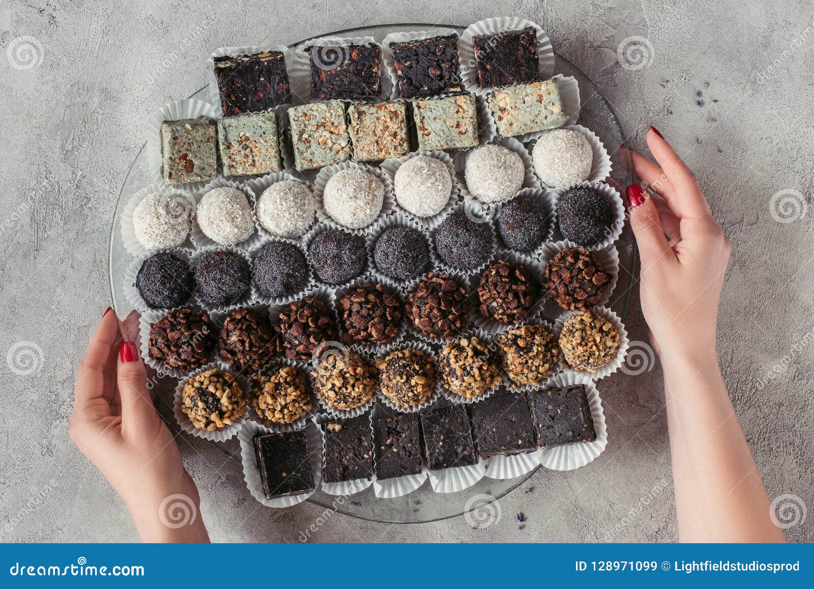 Partial View of Woman Holding Plate with Various Sweet Desserts Stock ... Partial View of Woman Holding Plate with Various Sweet Desserts Stock ...