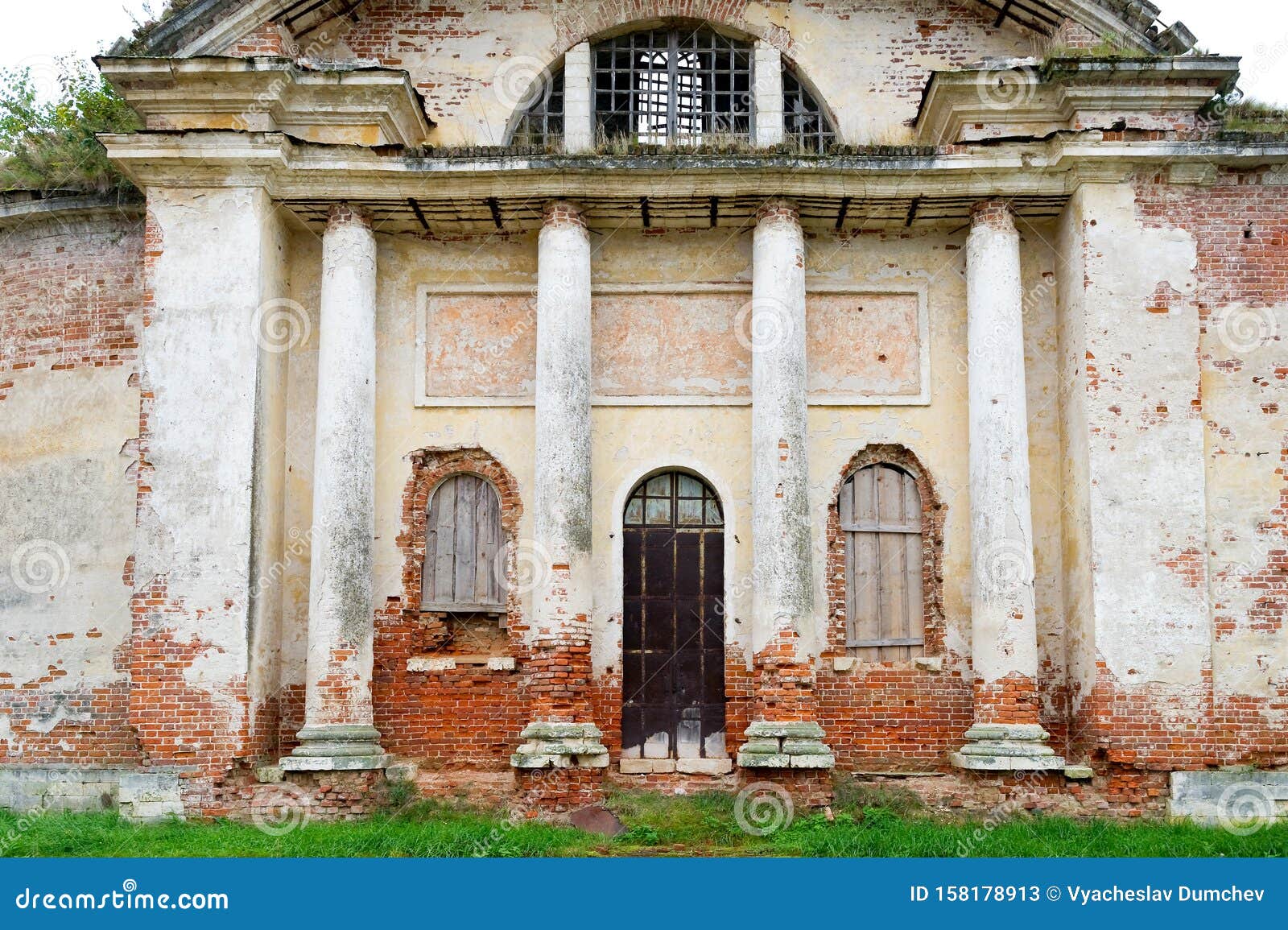 Partially Destroyed Facade of an Ancient Building with Boarded Up ...