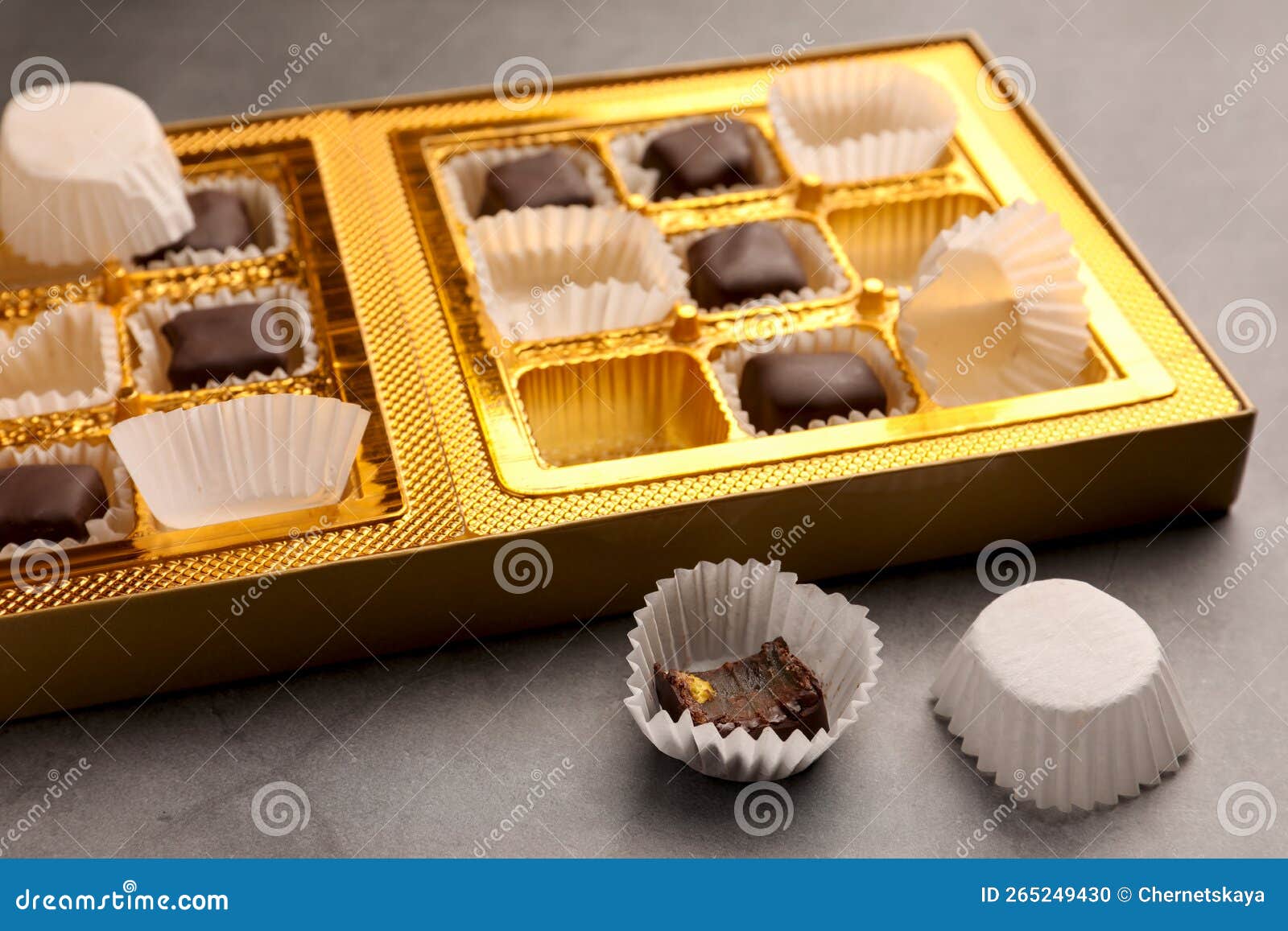 Partially Empty Box of Chocolate Candies on Grey Table Stock Photo ...