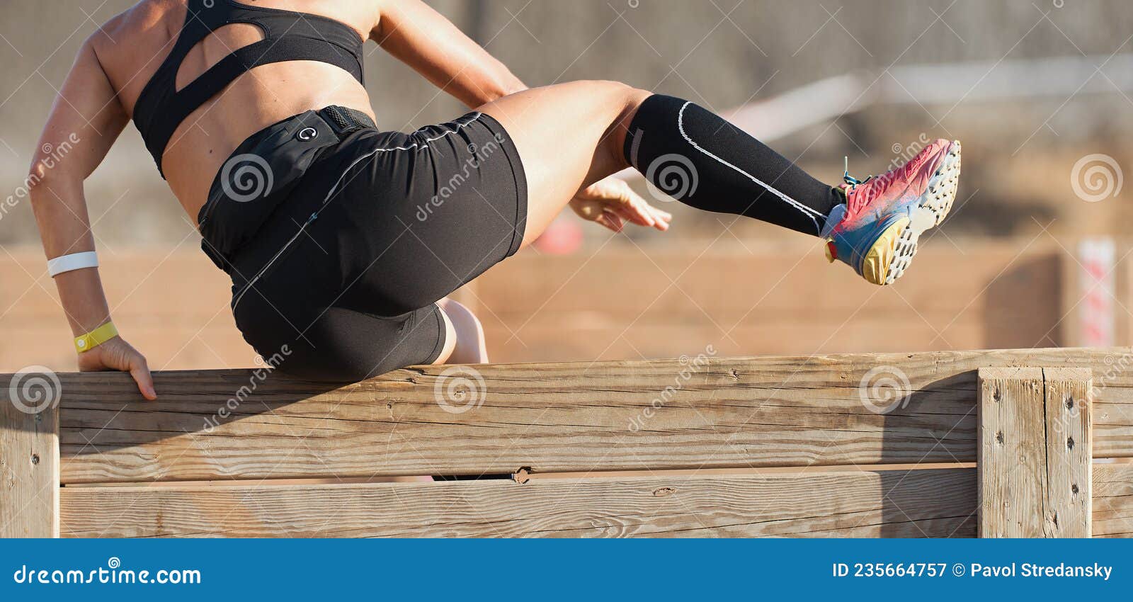 Participant in an Obstacle Course Running and Climbing a Wal Stock ...