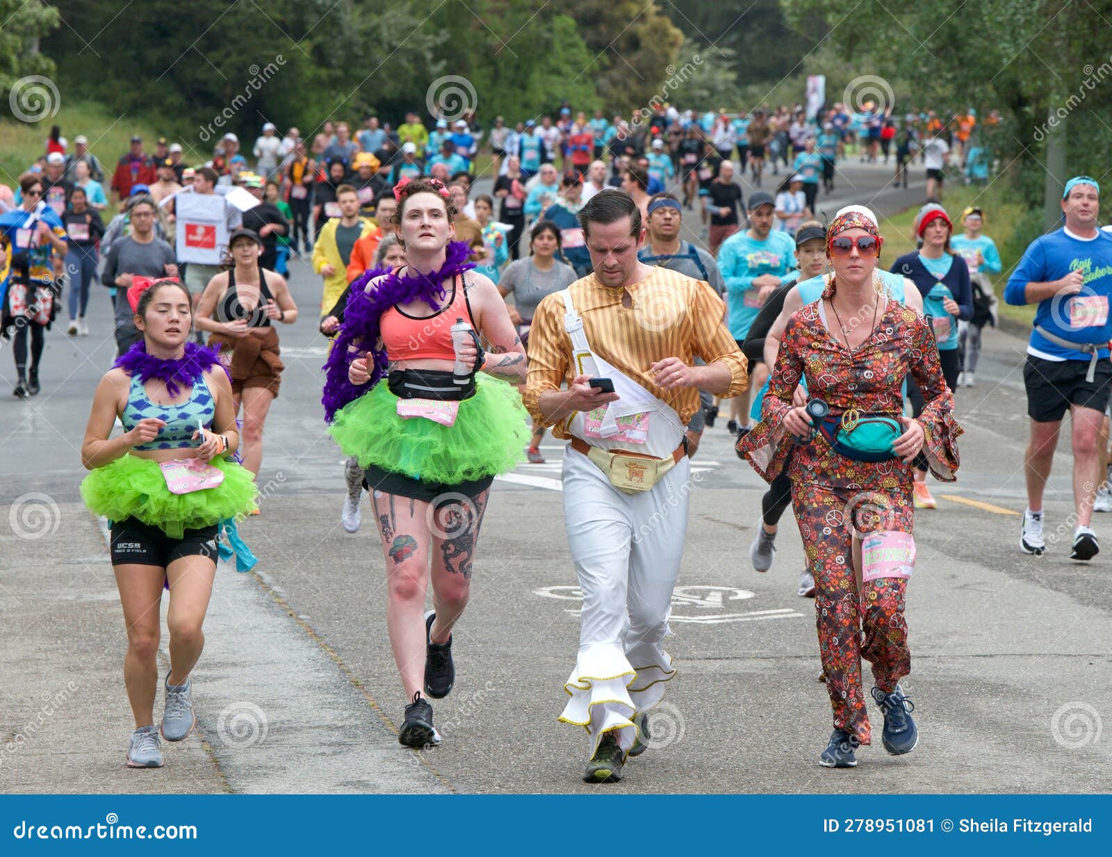 Participants in the Annual Bay To Breakers Race through San Francisco ...