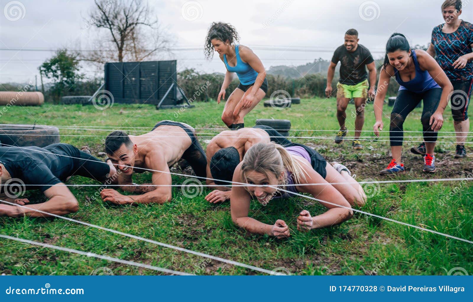 Participants in an Obstacle Course Crawling Stock Photo - Image of ...
