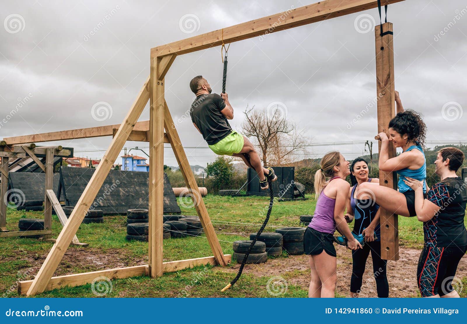 Participants in Obstacle Course Doing Pegboard and Rope Stock Photo ...