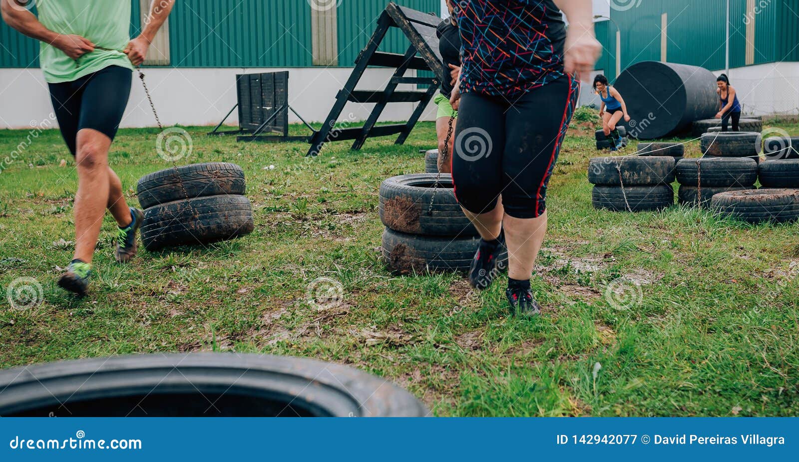 Participants in an Obstacle Course Dragging Wheels Stock Image - Image ...