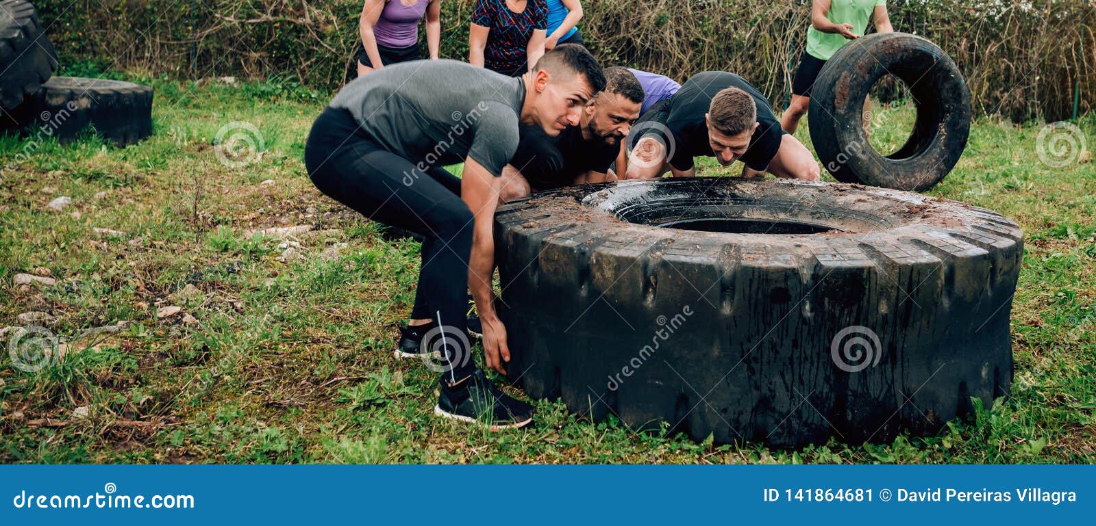 Participants in an Obstacle Course Turning a Wheel Stock Image - Image ...