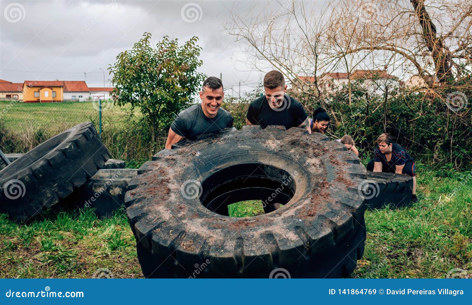 Participants in an Obstacle Course Turning a Wheel Stock Image - Image ...