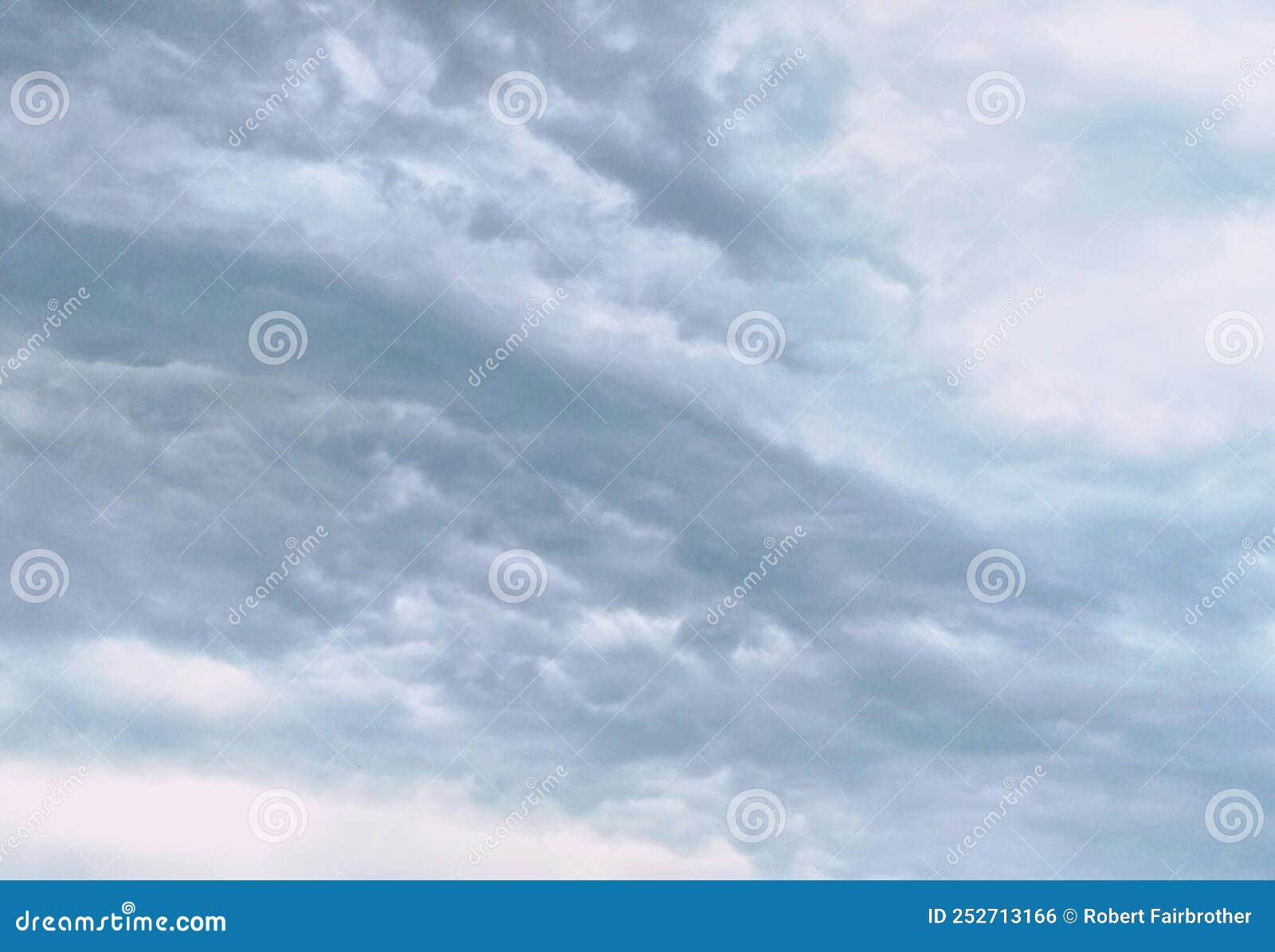 An Parting in the Thin Sheet of Clouds Under the Blue Sky Stock Photo ...