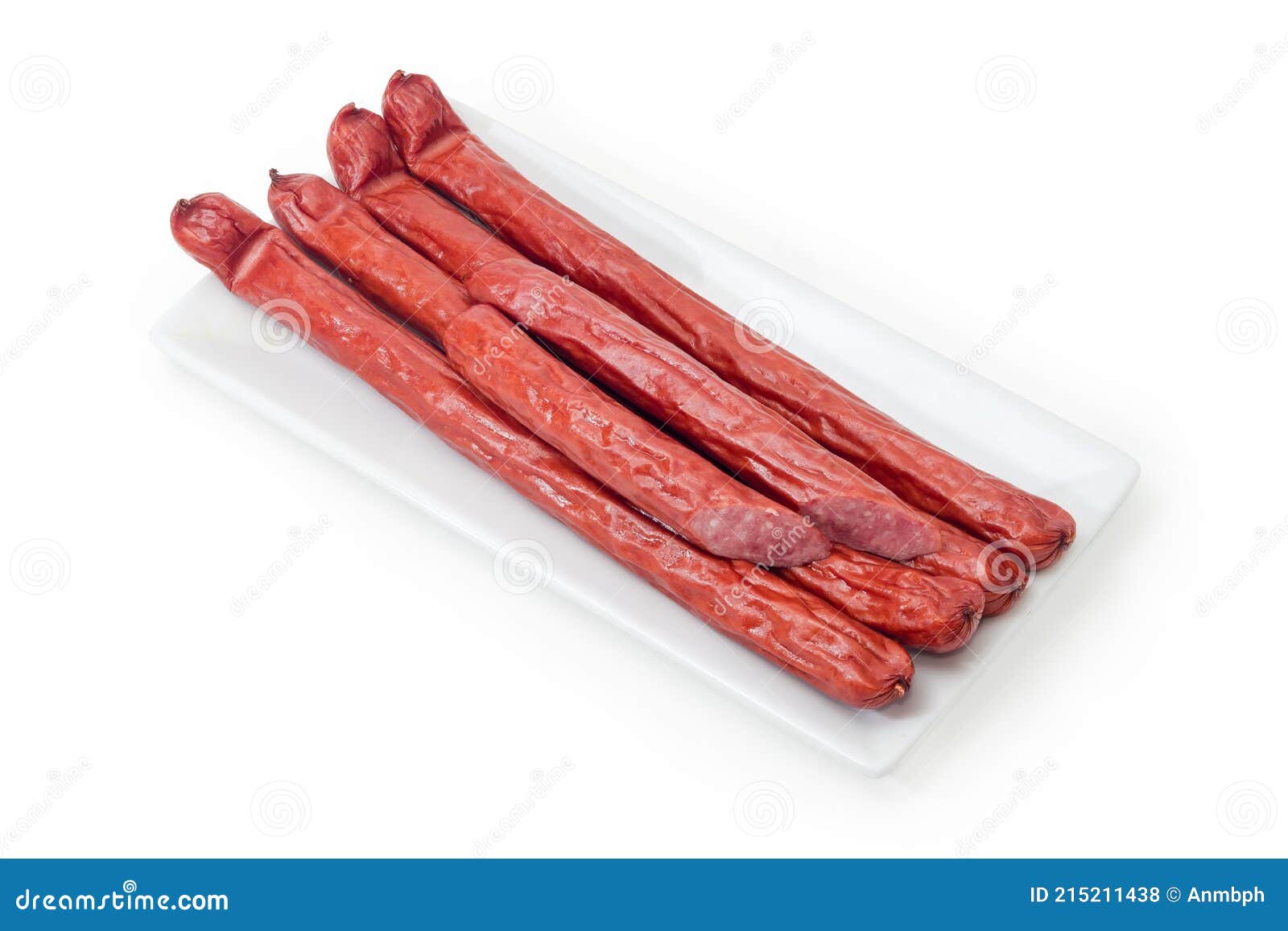 Partly Cut Long Thin Smoked Sausages on White Rectangular Dish Stock ...