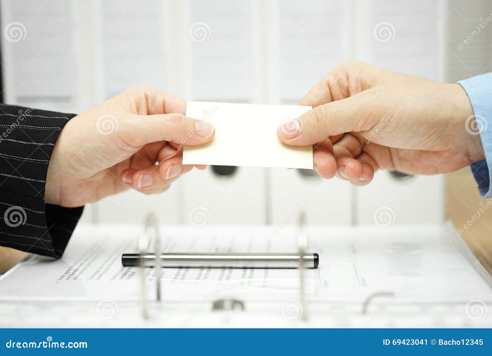 Partners are Exchanging Business Cards after Successful Meeting Stock ...