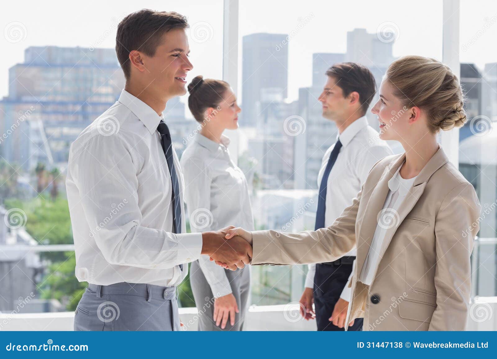 Partners Giving a Handshake Stock Photo - Image of business, office ...