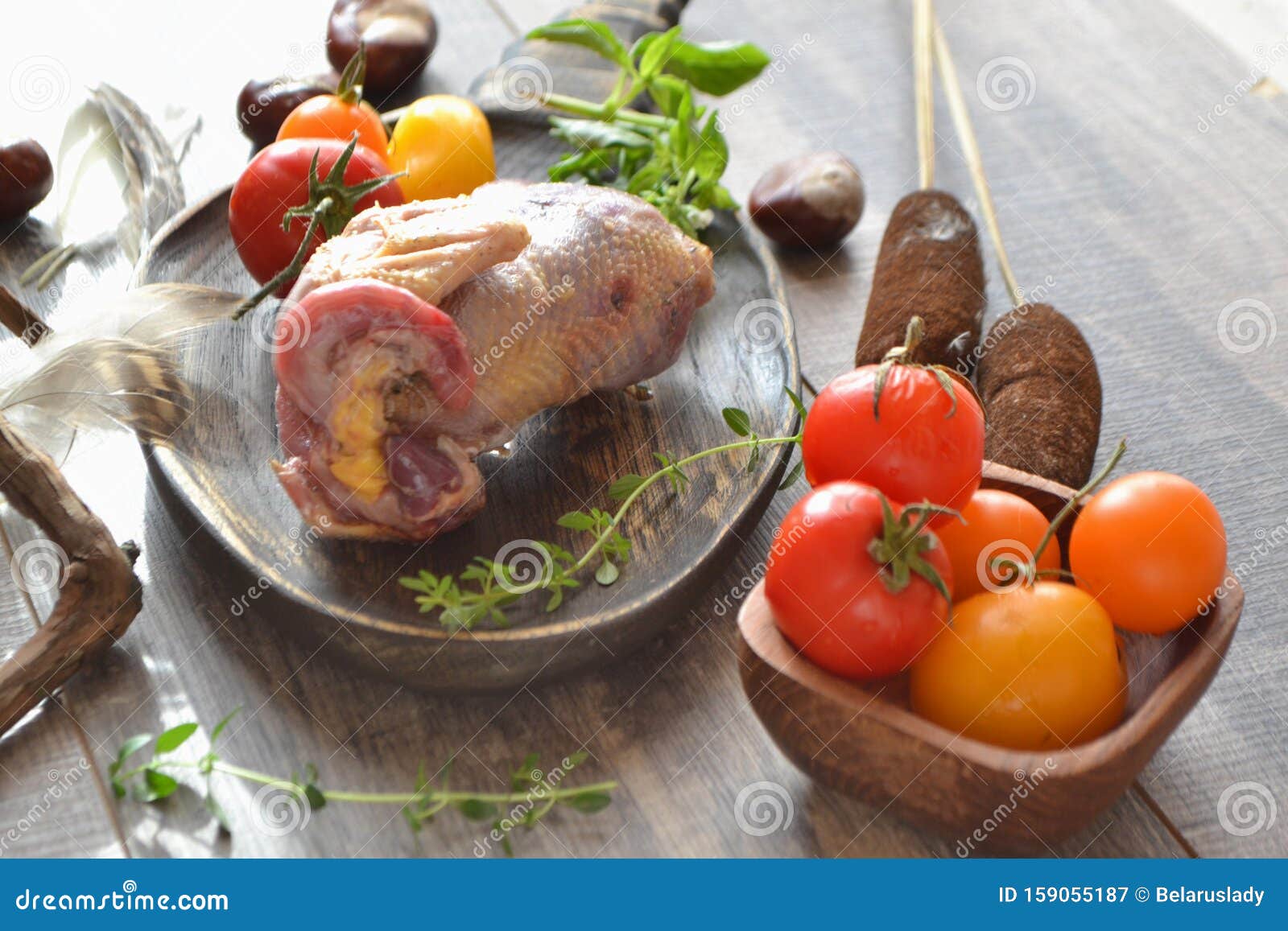 Partridge Fresh Wild Bird with Colorful Tomatoes on Dark Rustic Table ...