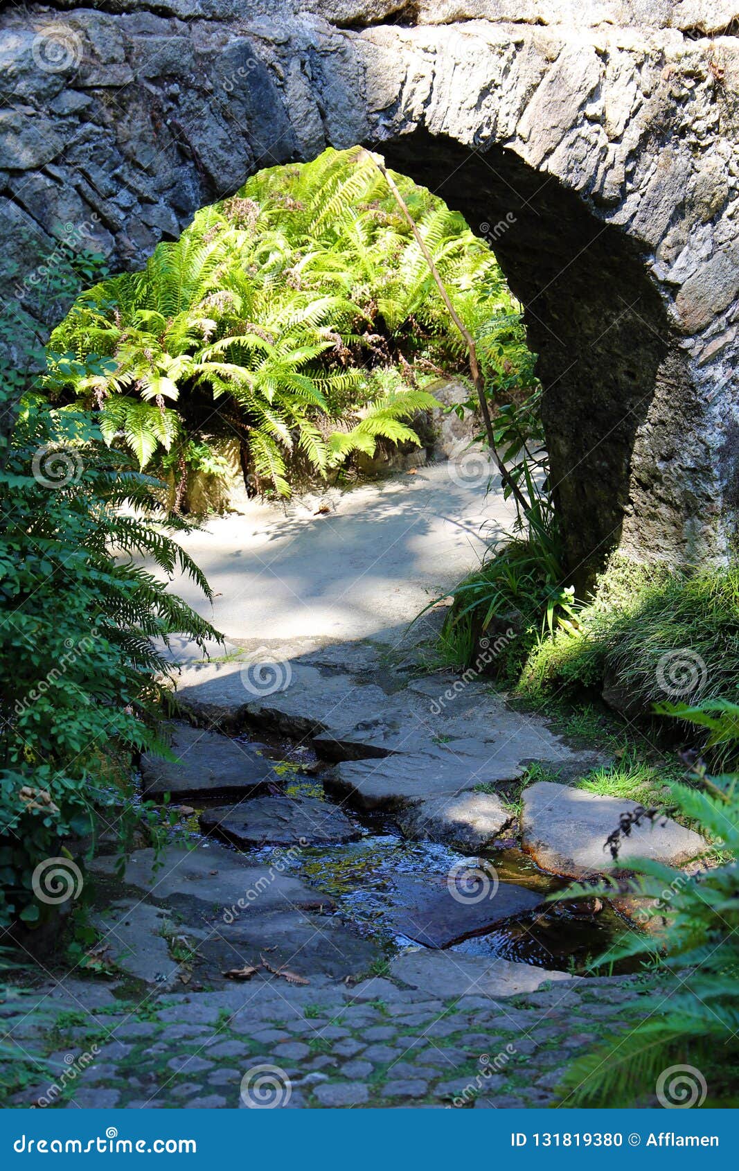 Passage through stone arch stock photo. Image of arch - 131819380