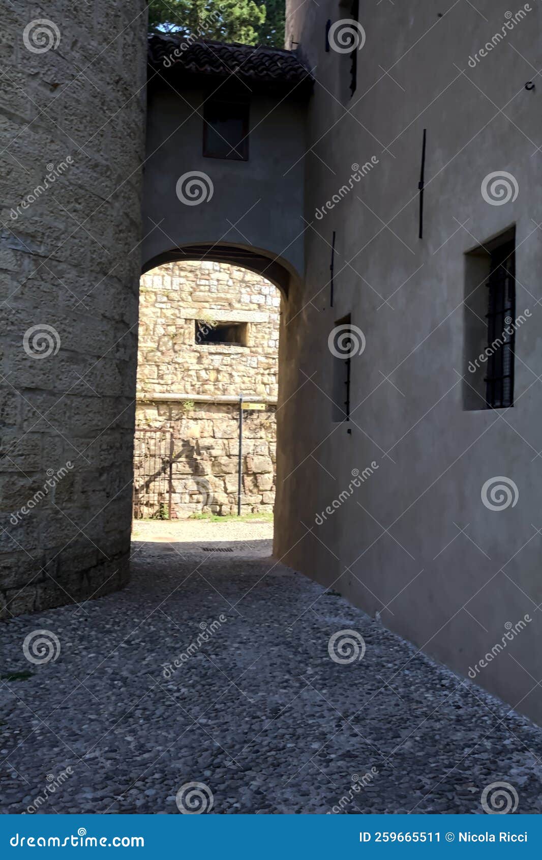 Passageway with an Arch between Two Buildings Stock Image - Image of ...