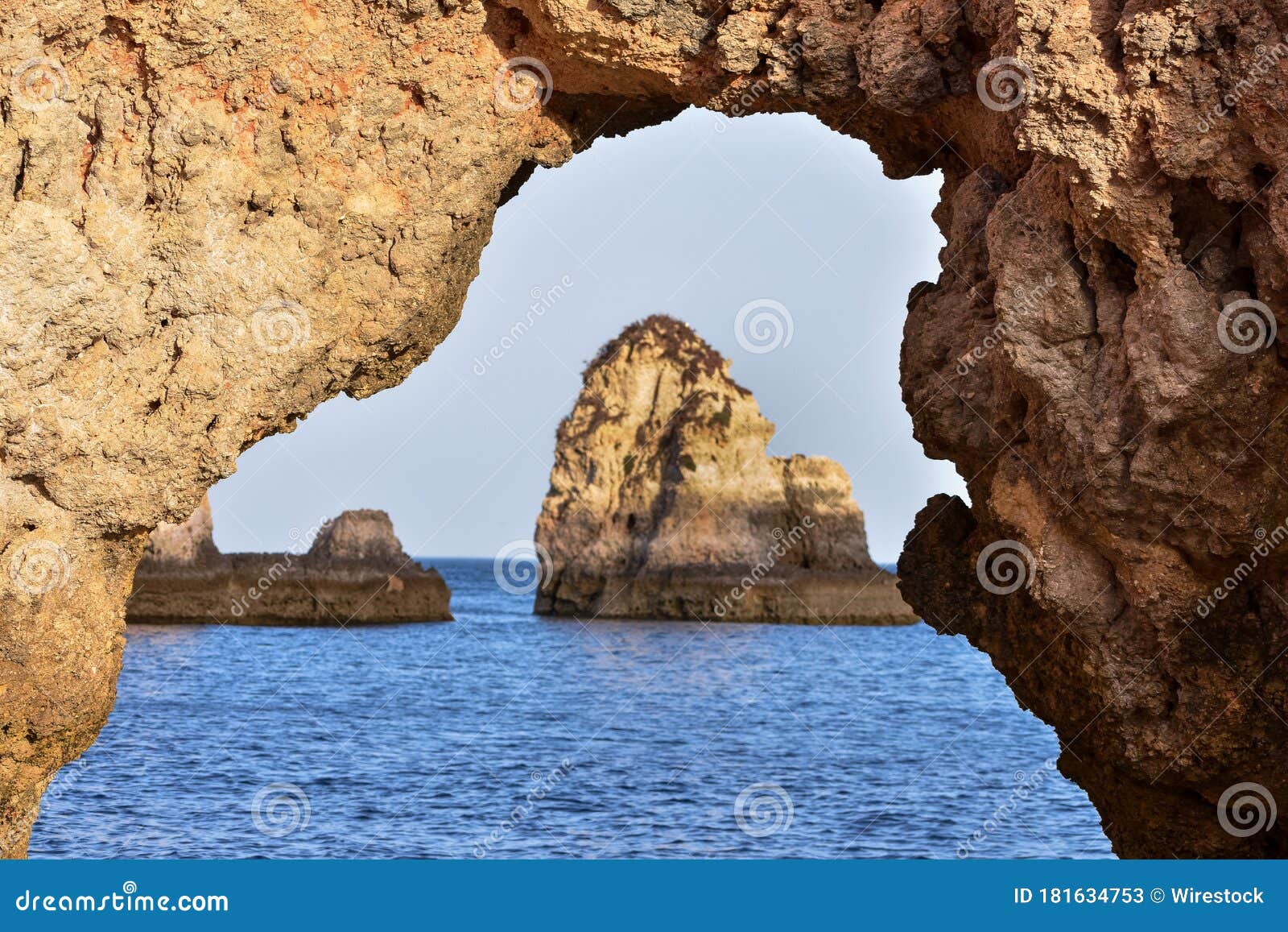 Passageway Created through the Cliff Over the Water Stock Image - Image ...