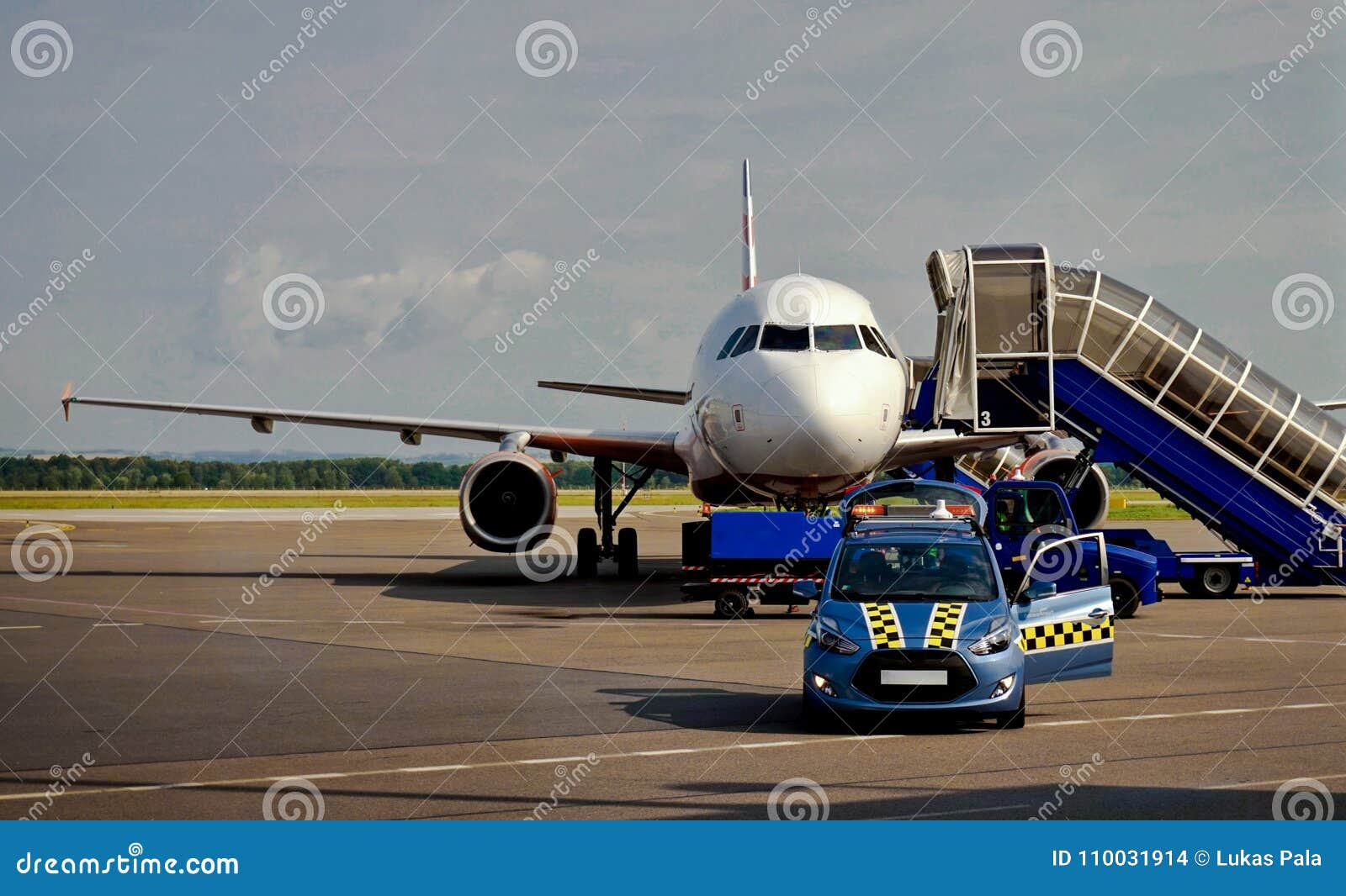 Docked Airplane on a Runway Stock Photo - Image of dock, airline: 110031914