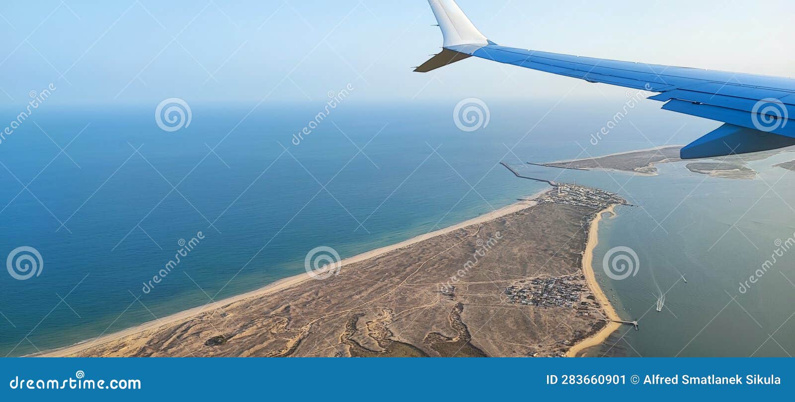 A Passanger Plane Wing Image with a Land Bellow Stock Image - Image of ...