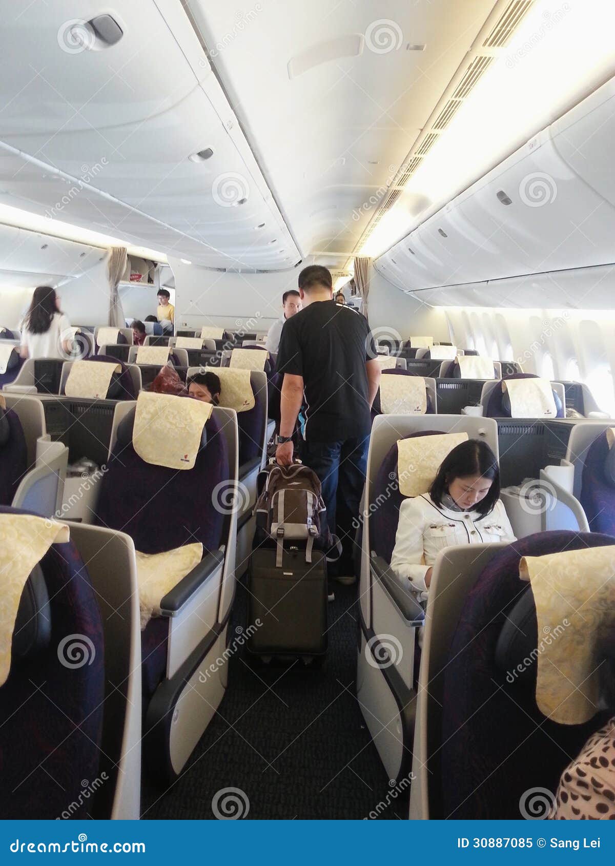 Passenger in airplane editorial image. Image of engine - 30887085