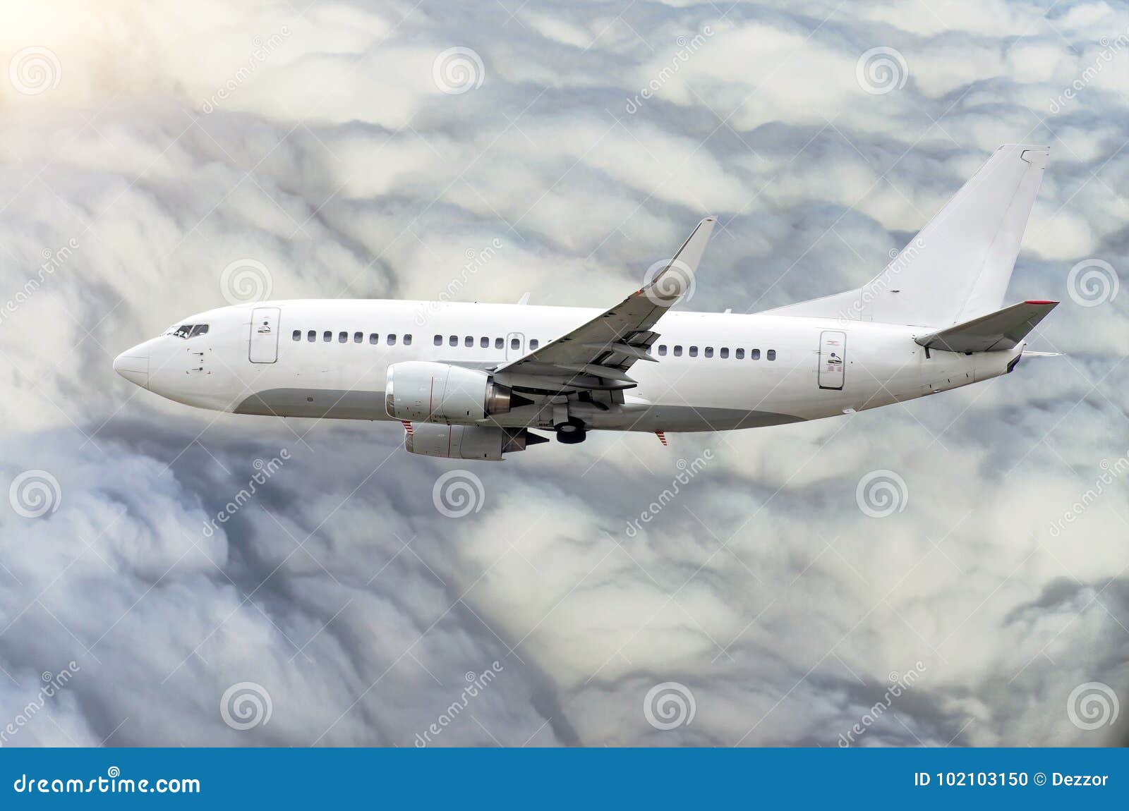 Passenger Airplane Flies in the Sky Gaining Height Above the Clouds ...