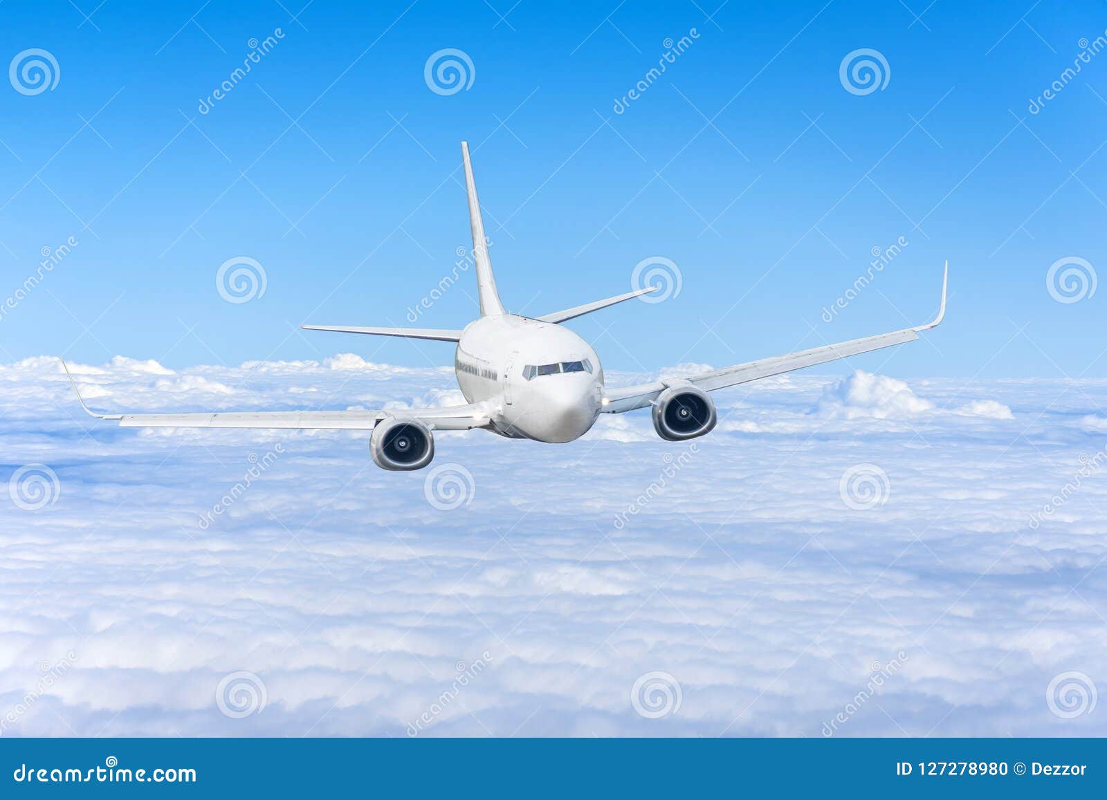 Passenger Airplane Fly on a Hight Above Overcast Clouds and Blue Sky ...