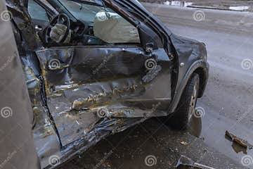 A Passenger Car Crashed into a Pole. Dented Side Doors Stock Image ...