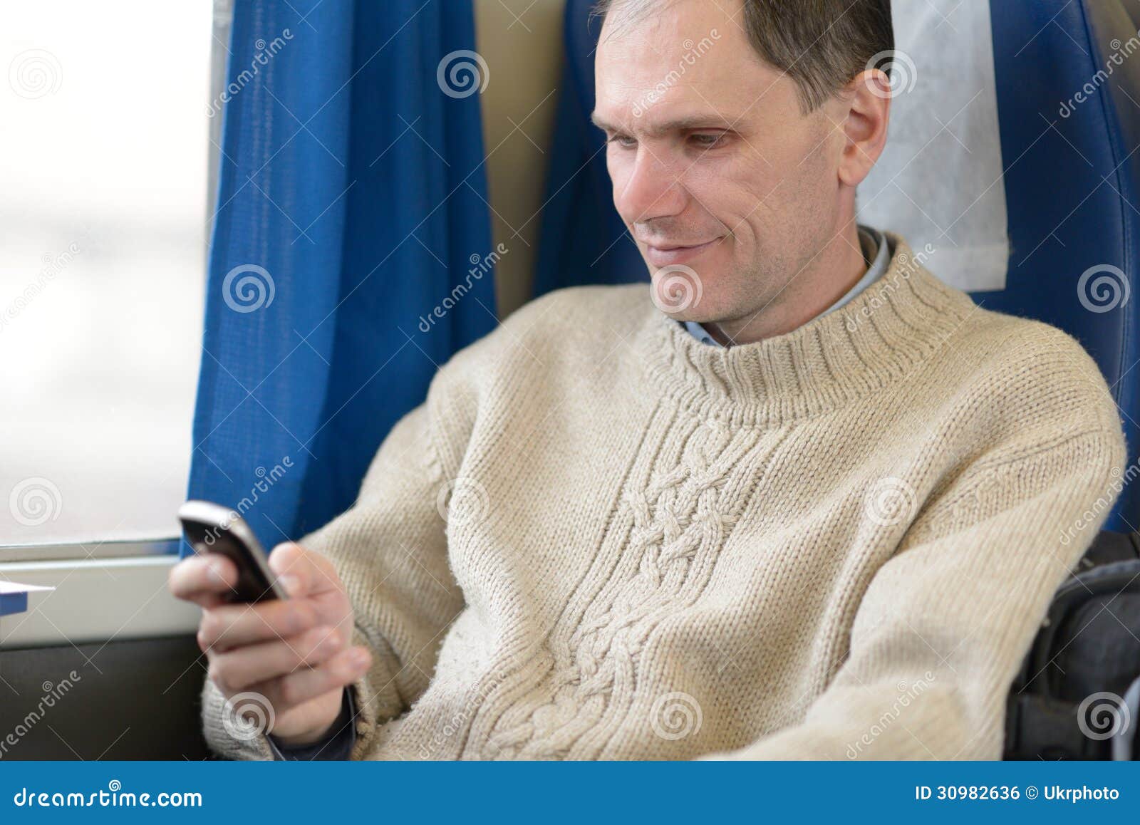 Passenger with Cell Phone in a Train Stock Photo - Image of caucasian ...