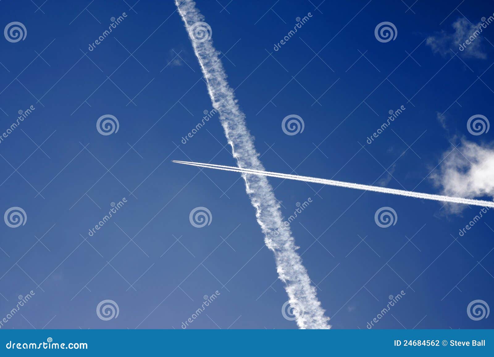Passenger Jet Trails Crossing in a Blue Sky Stock Photo - Image of ...