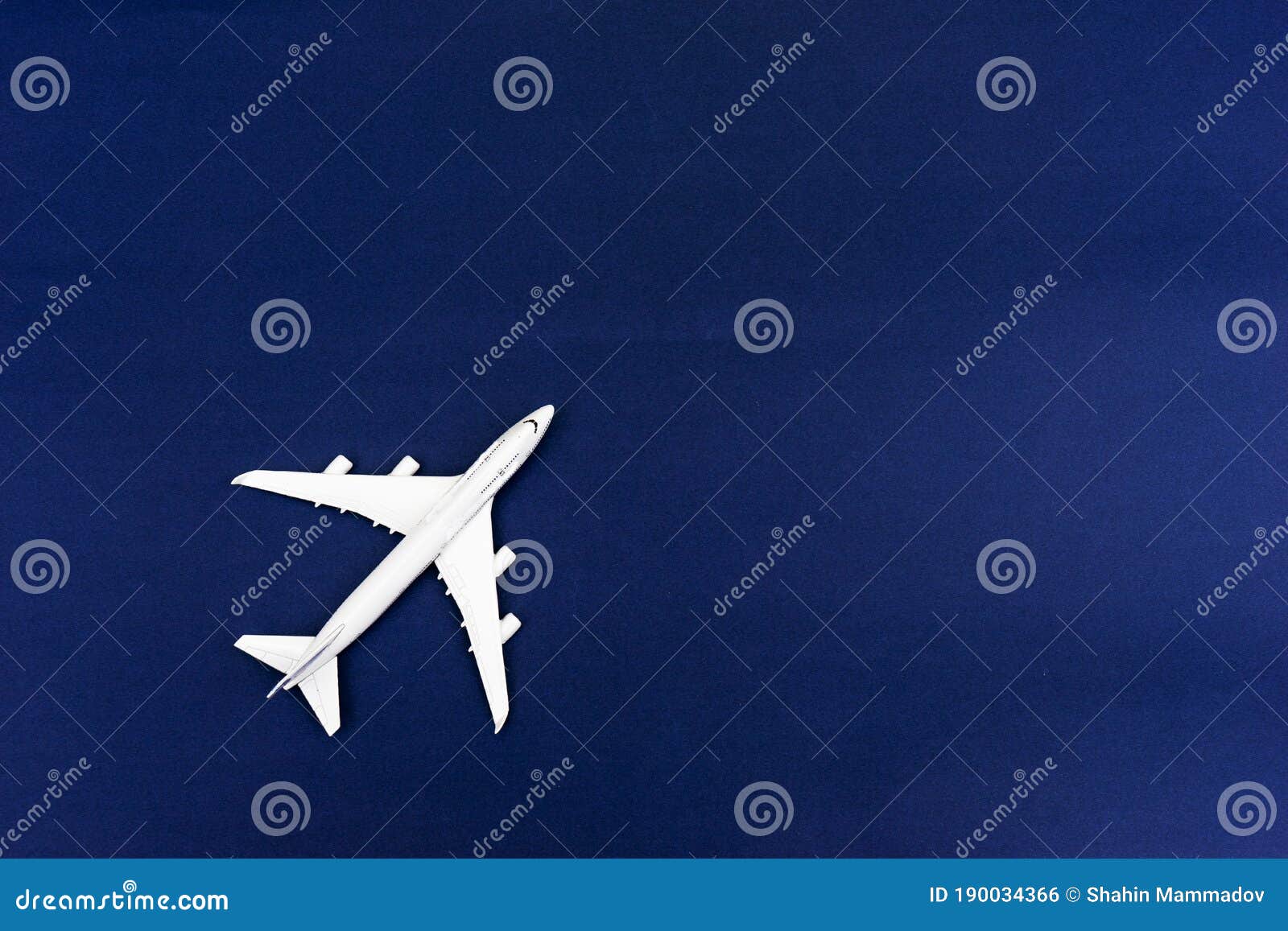 Passenger Model Airplane on a Blue Background. Free Space for Text ...