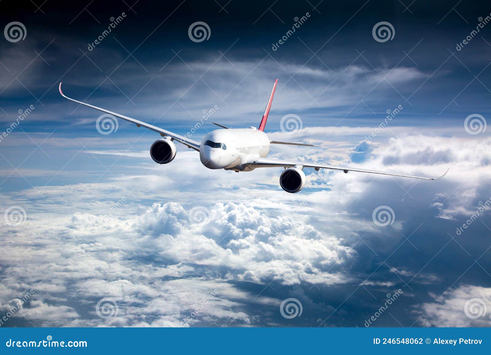 Passenger Aircraft Flies High Above the Clouds. Front View. Right ...