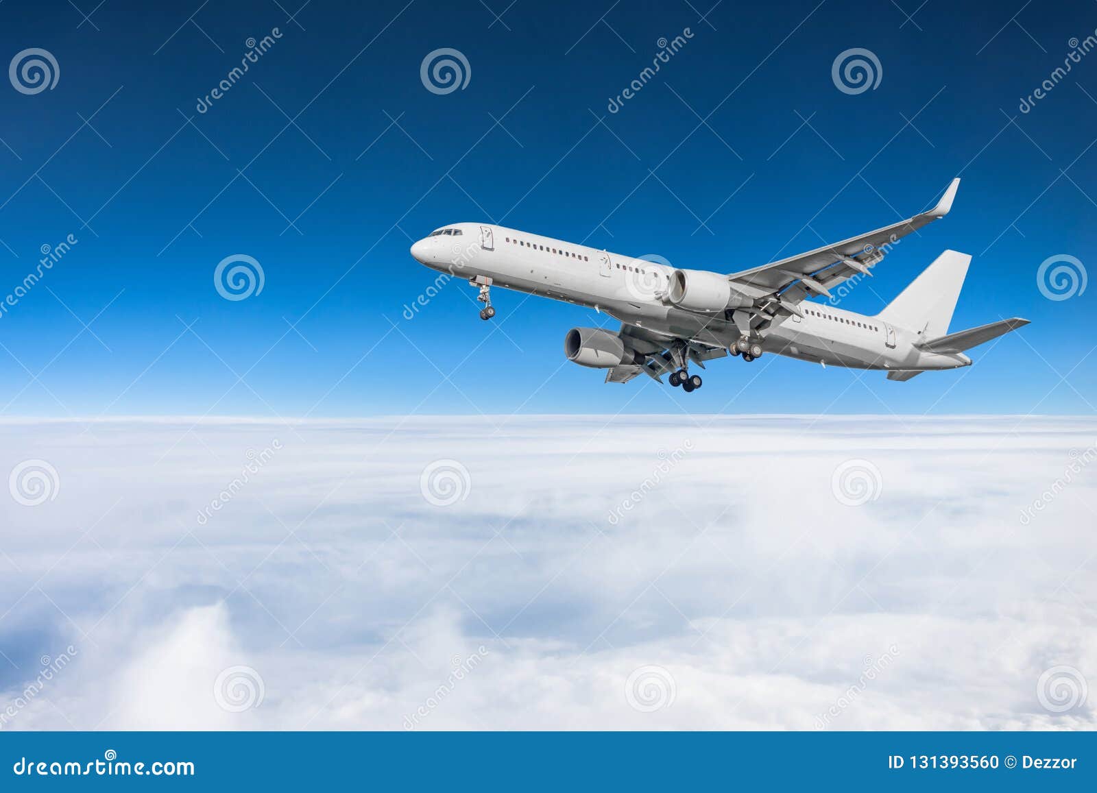 Passenger Plane Fly on a Train Above Clouds and Blue Sky Stock Photo ...