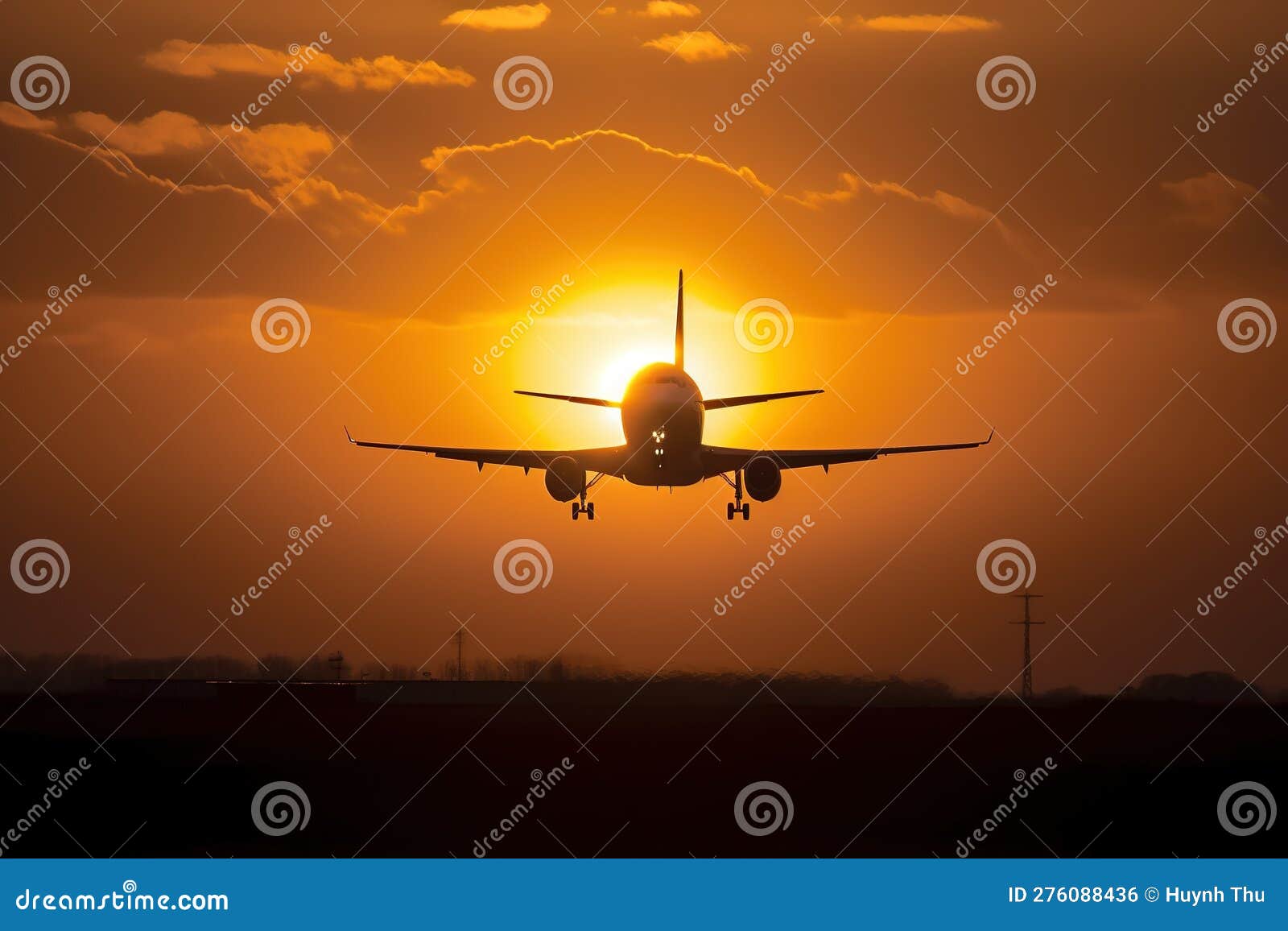 A Passenger Plane Flying into the Sunset with the Big Sun Stock ...
