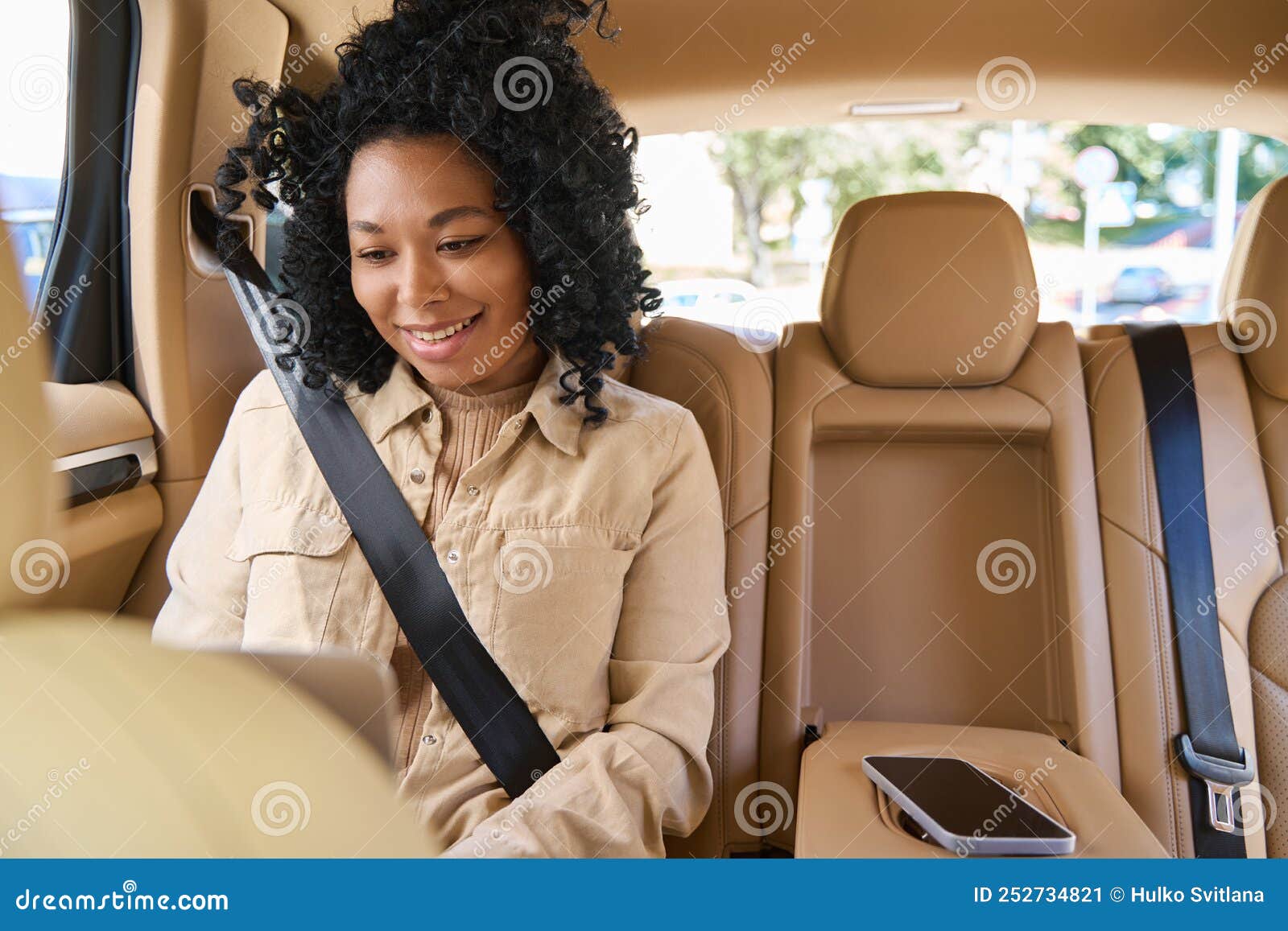 Passenger is Texting in the Back Seat of the Car Stock Image - Image of ...
