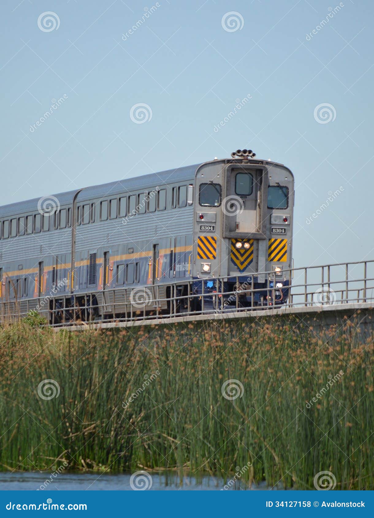 A Passenger Train Approaching Down the Tracks Stock Photo - Image of ...