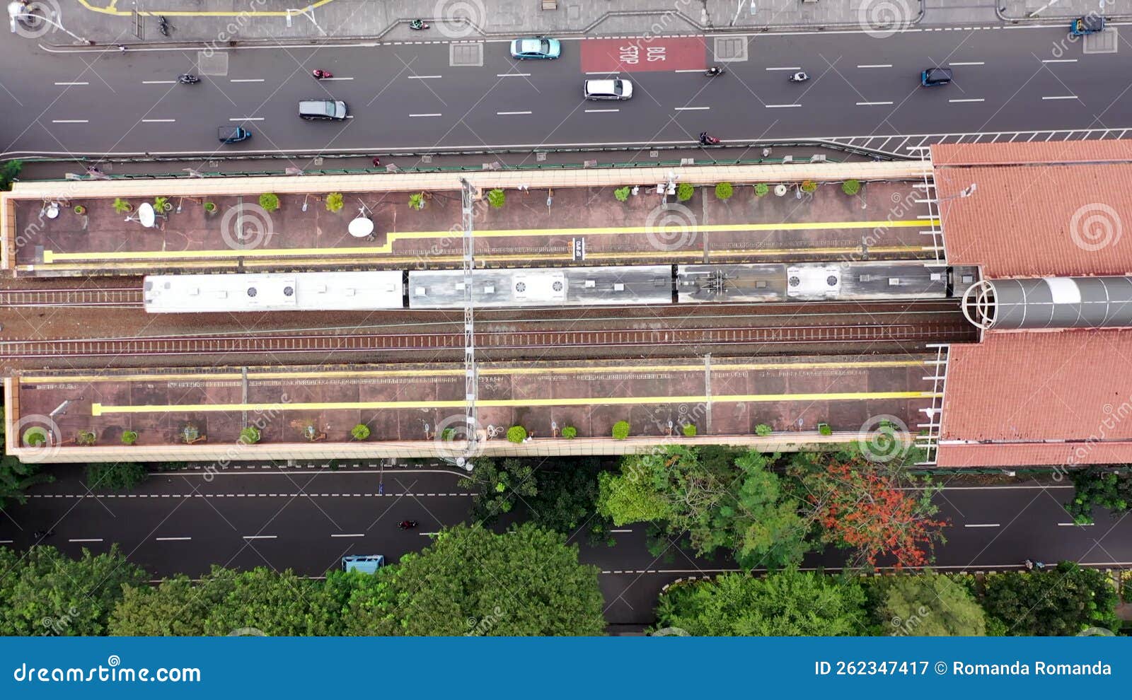 Passenger Train Arriving and Stopping at the Platform, Top Down Aerial ...