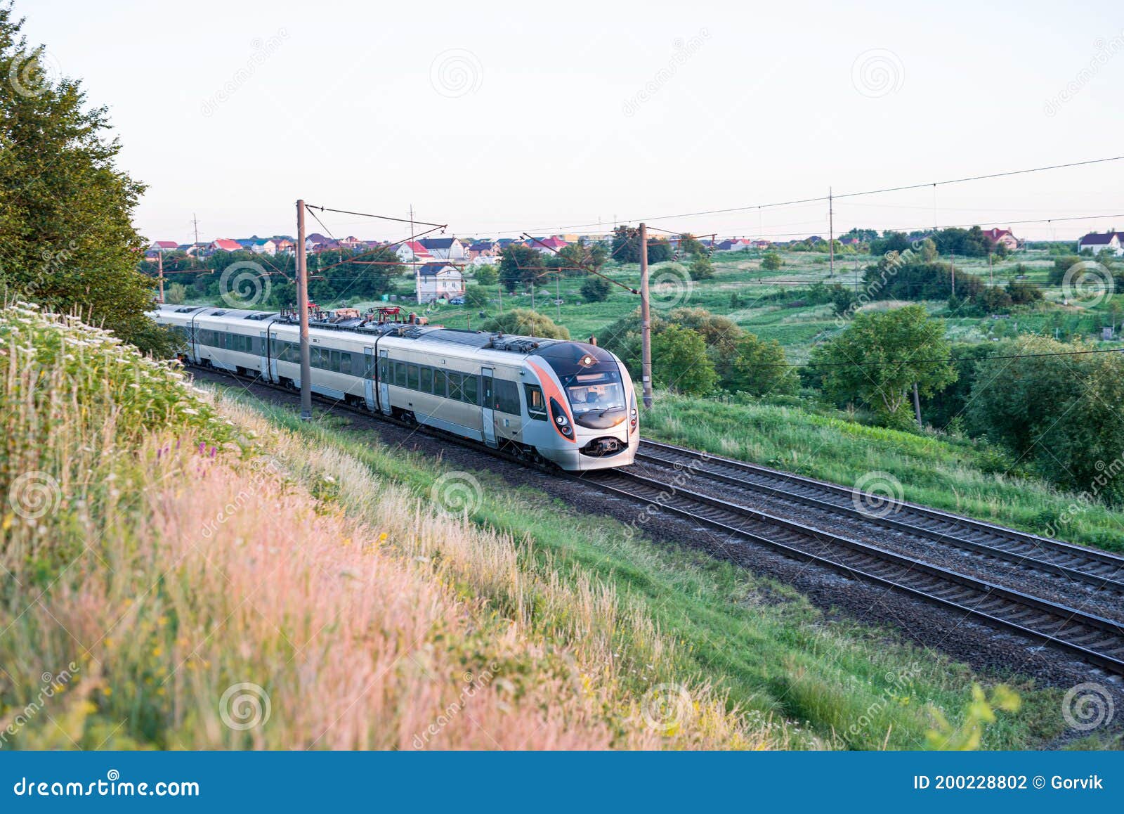 Passenger Train with Cars while Moving on the Railway Stock Photo ...