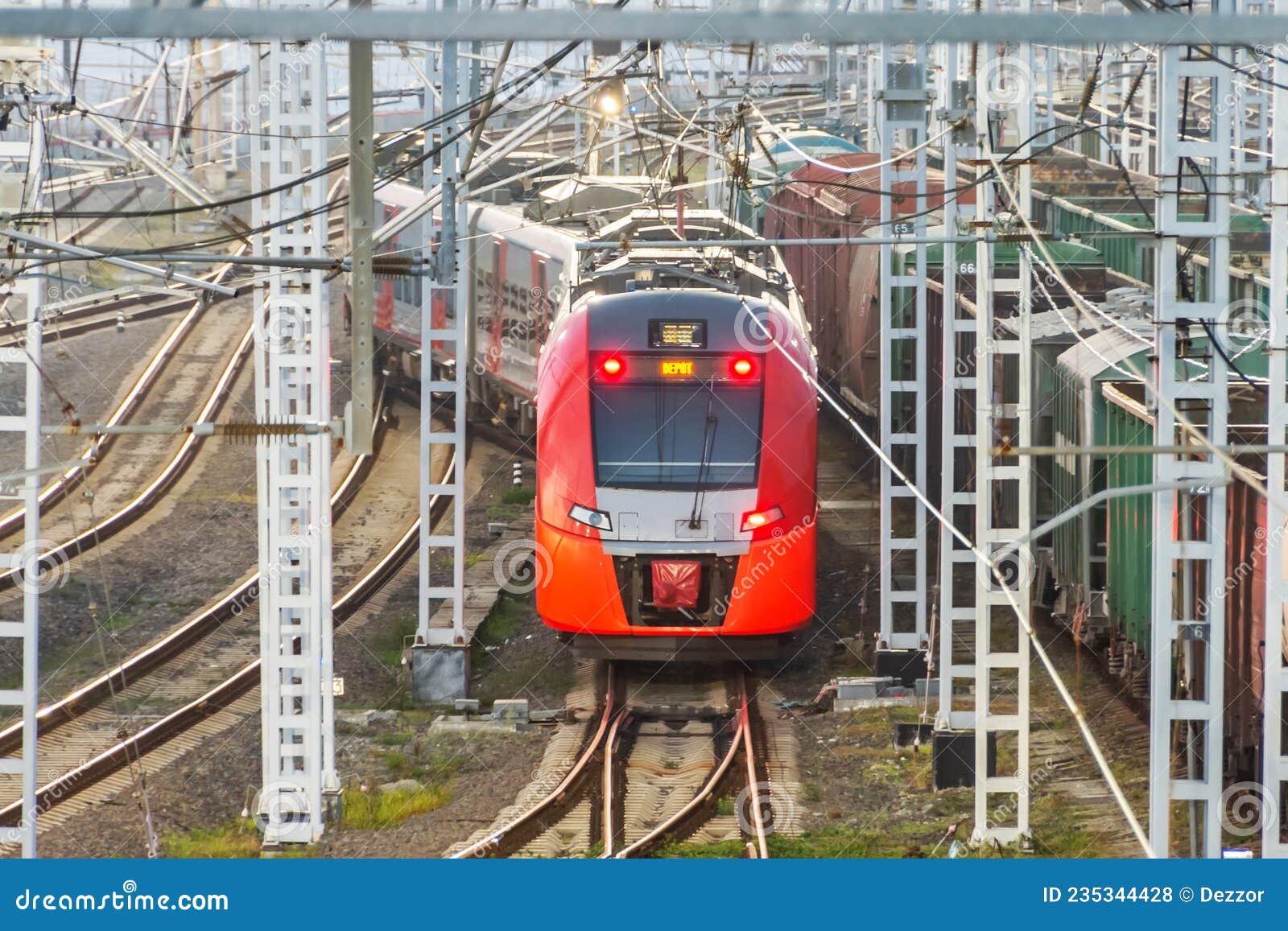 Passenger Train Leaving a Large Cargo Station Stock Photo - Image of ...