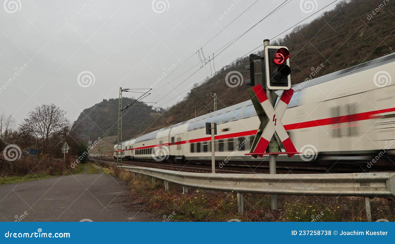 A Passenger Train Passes a Red Warning Sign Stock Footage - Video of ...
