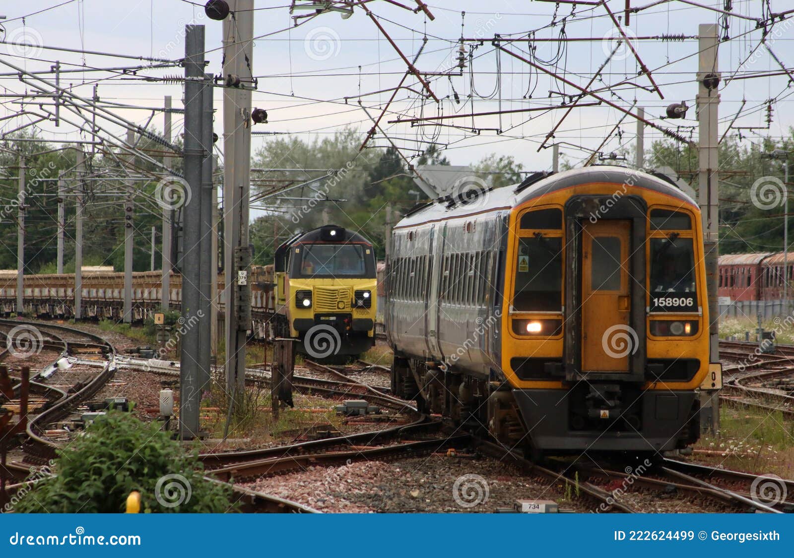 Passenger Train Passing Freight Train at Carnforth Editorial Stock ...