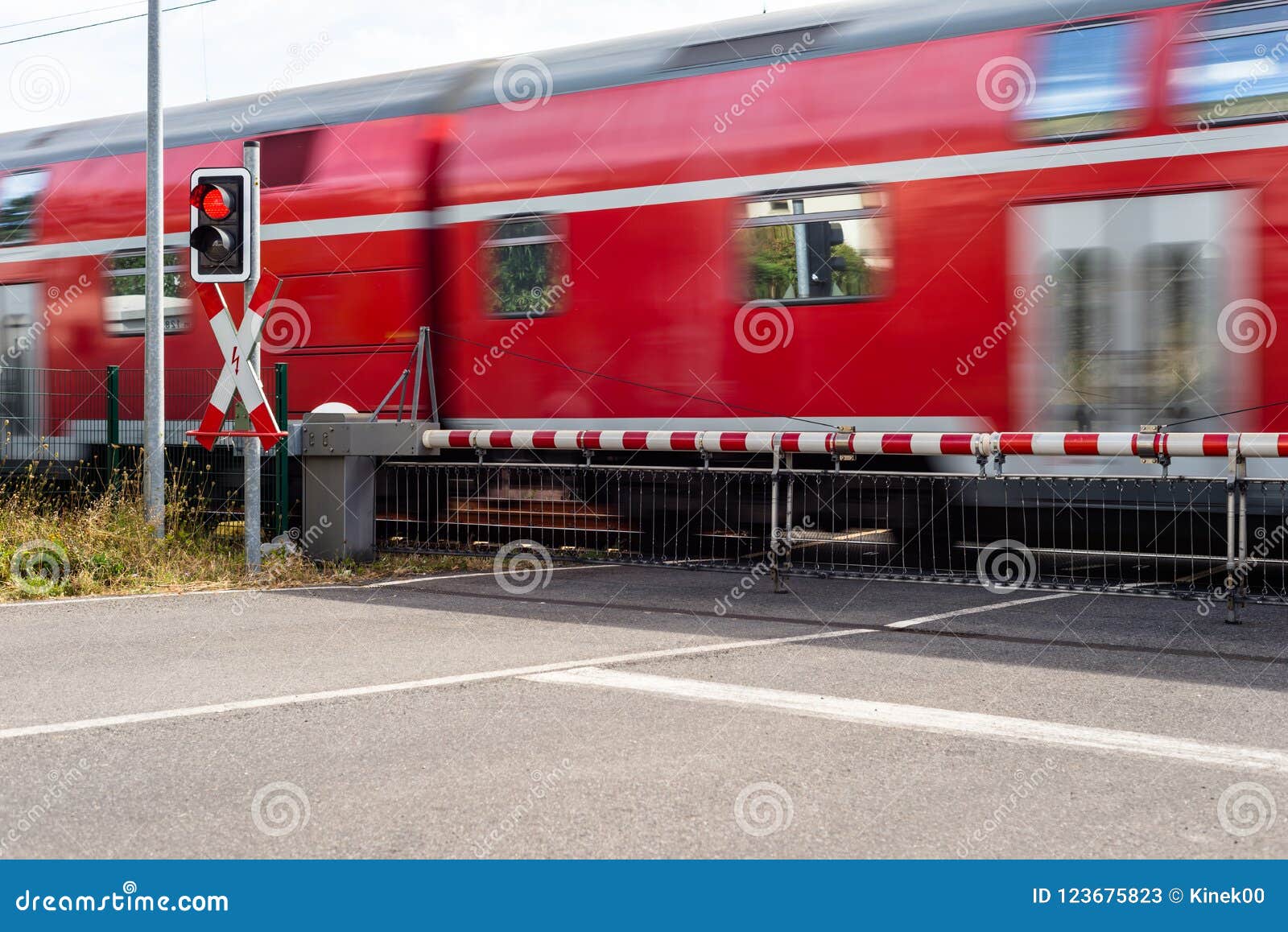 A Passenger Train Passing through a Guarded Railway Crossing with ...