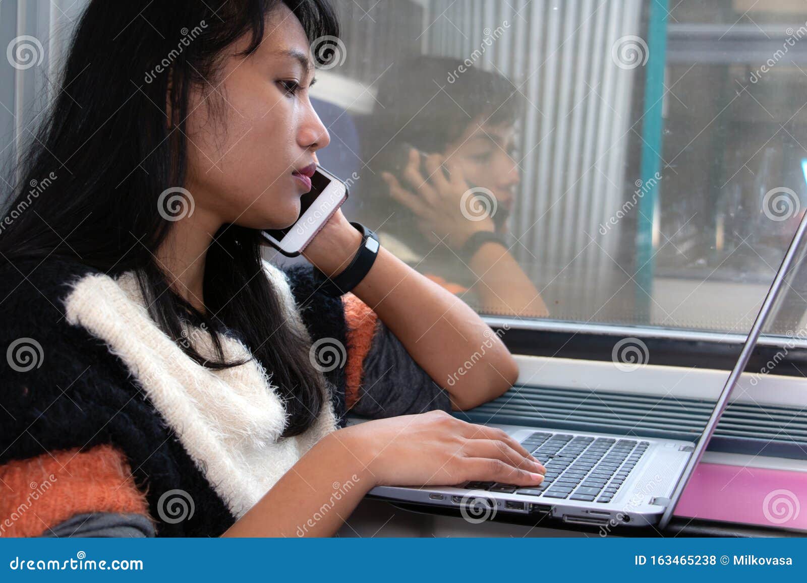 Passenger Writes on Laptop on a Moving Train Stock Photo - Image of ...