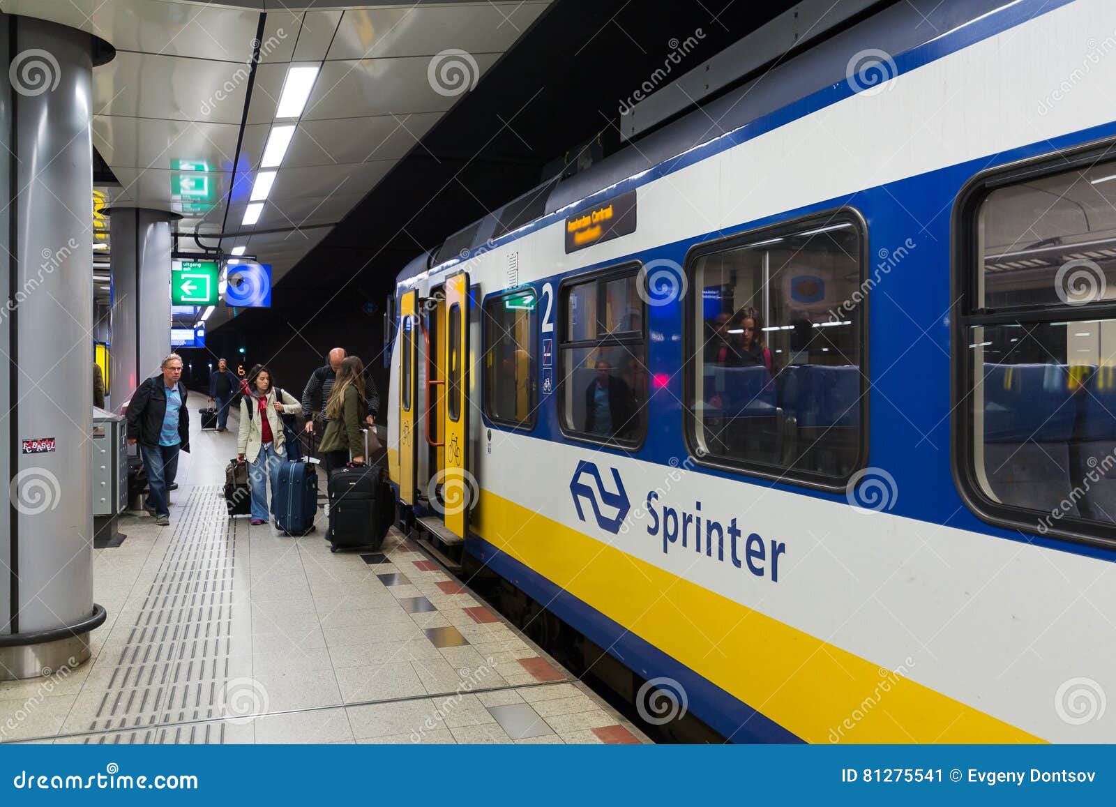 Passengers Board the Train at the Schiphol Railway Station. Editorial ...