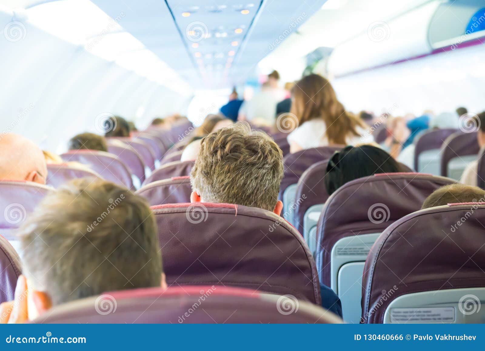Passengers inside airplane stock photo. Image of airplane - 130460666