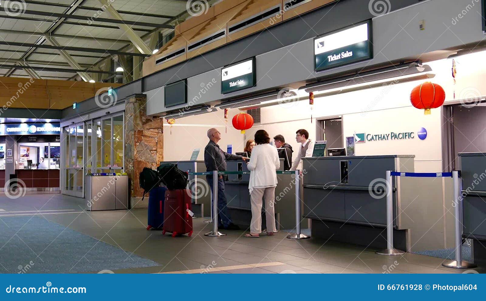 Passengers with Luggage at Cathay Pacific Check in Counter Stock ...